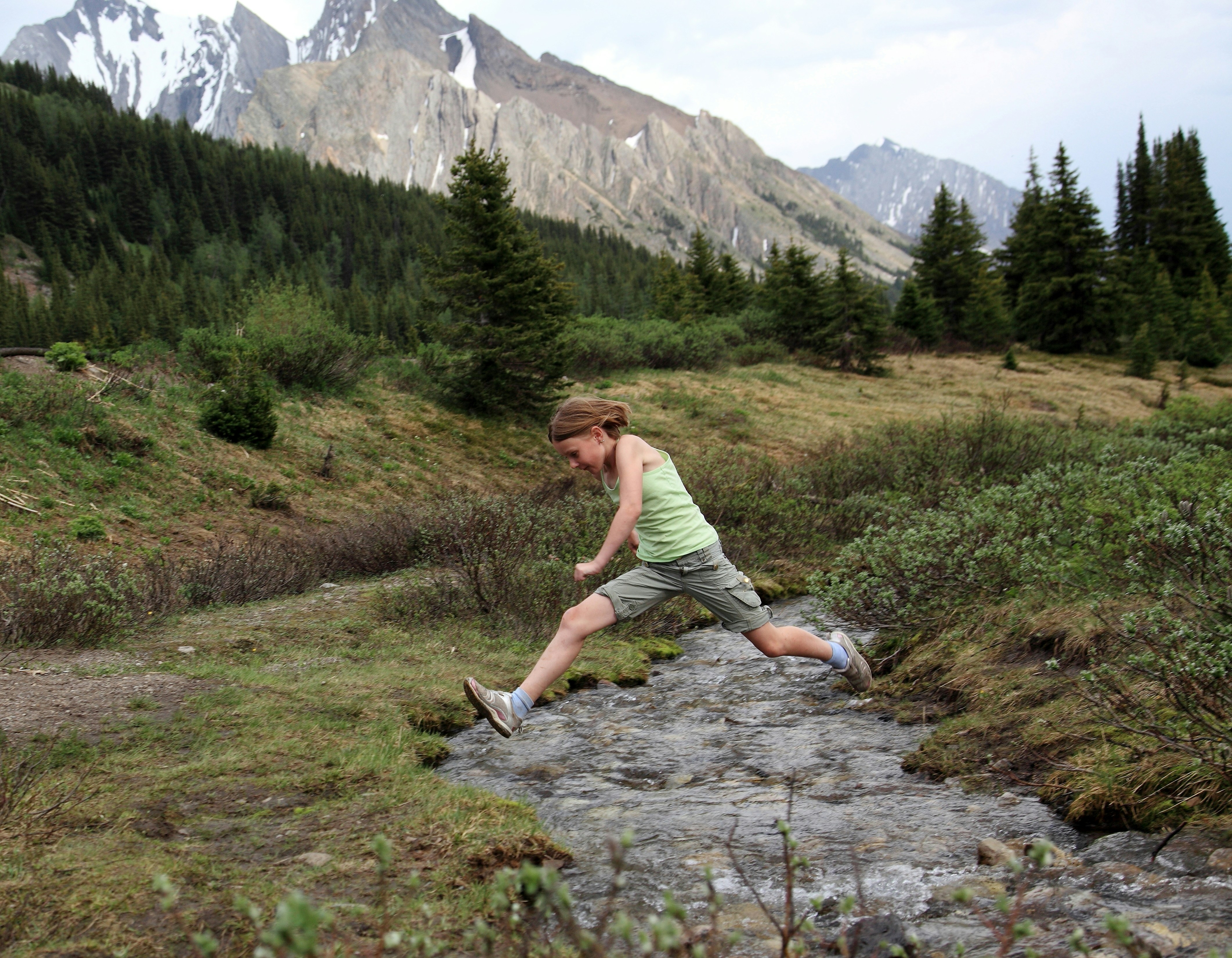Ridge Runner: A Shallow River Crossing Through Alpine Terrain