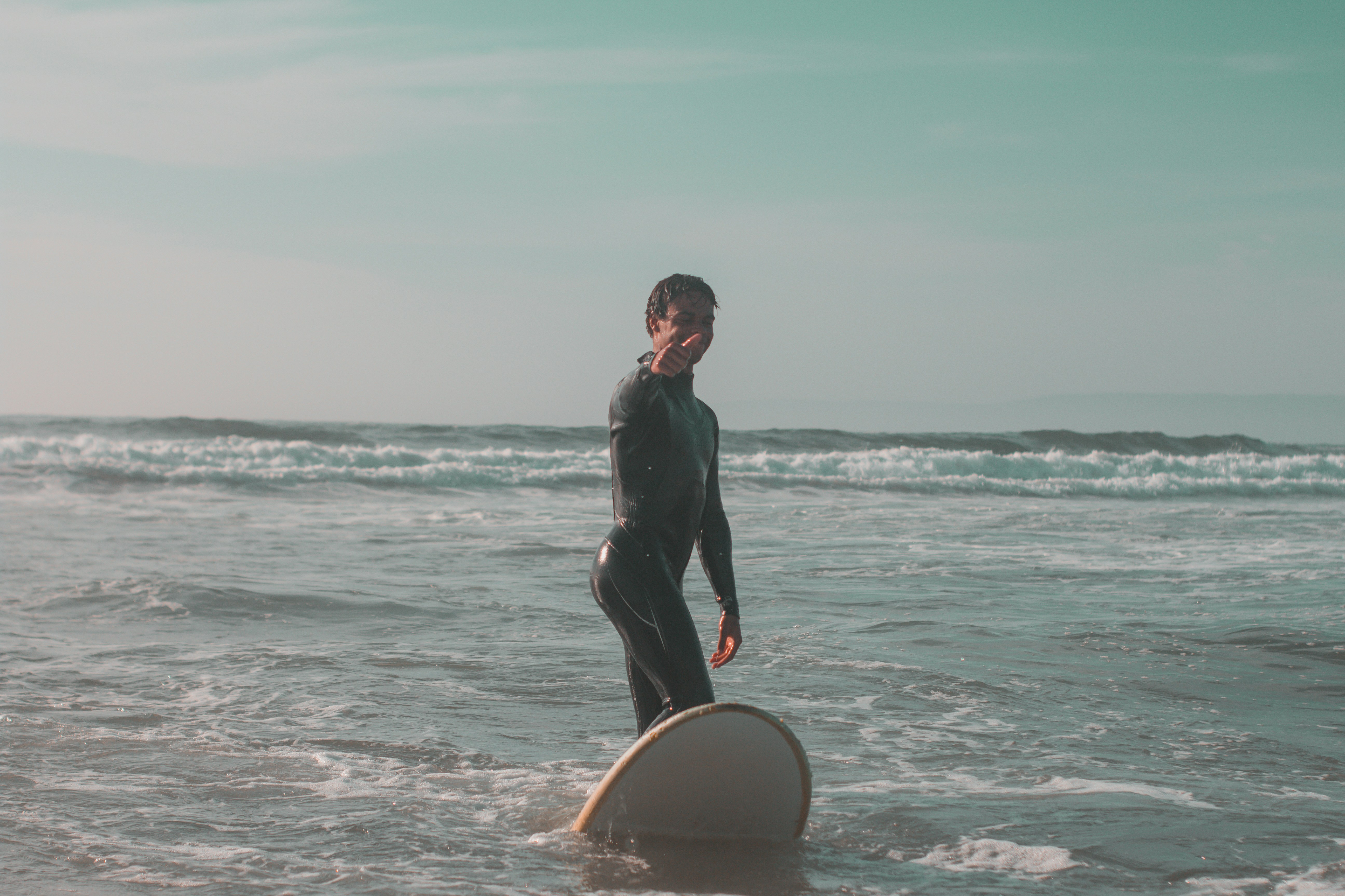 Surfer in Calm Break: Quiet Confidence at the Shore