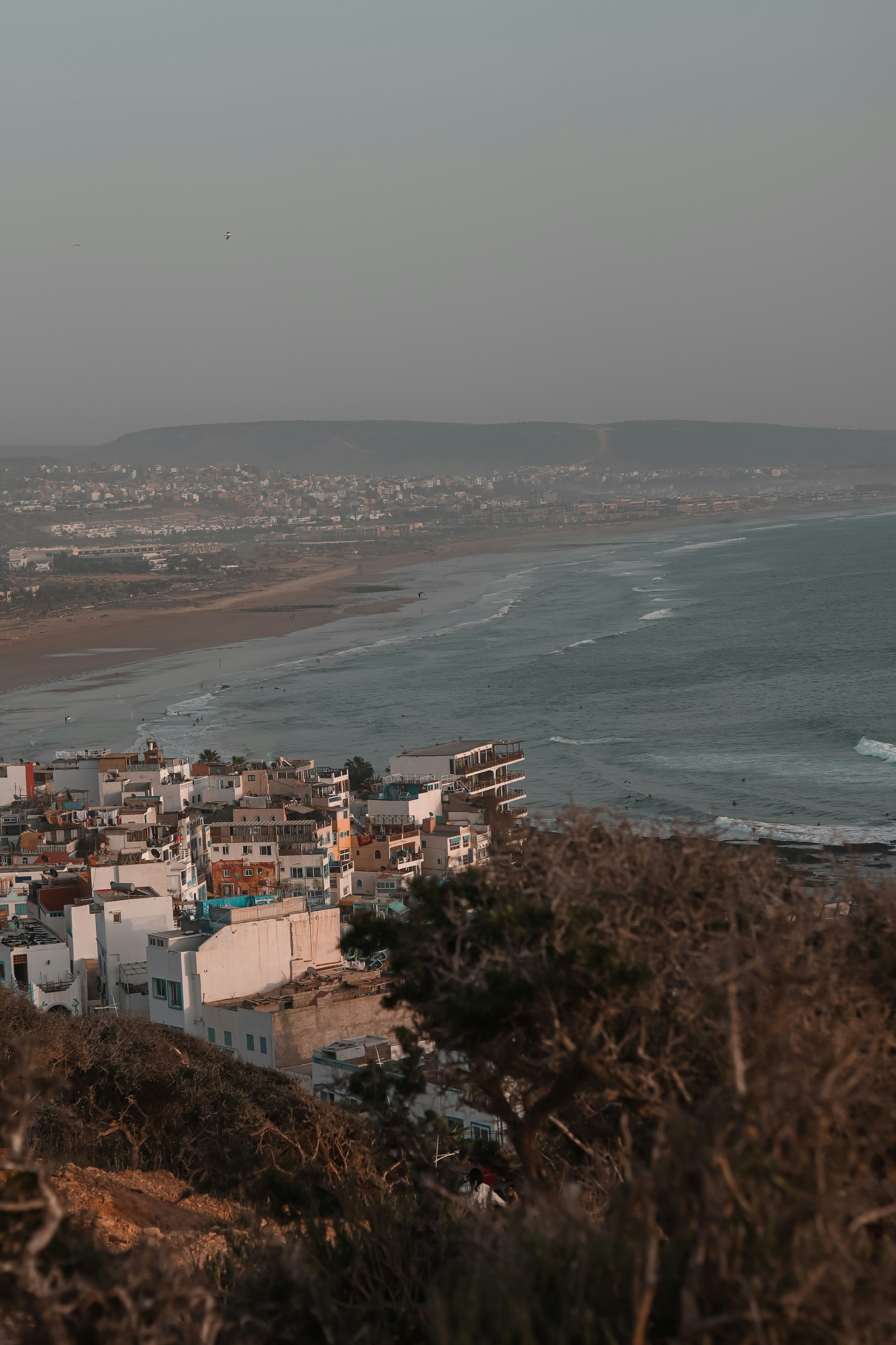 Coastal Panorama: Coastal town tucked along a sweeping shoreline