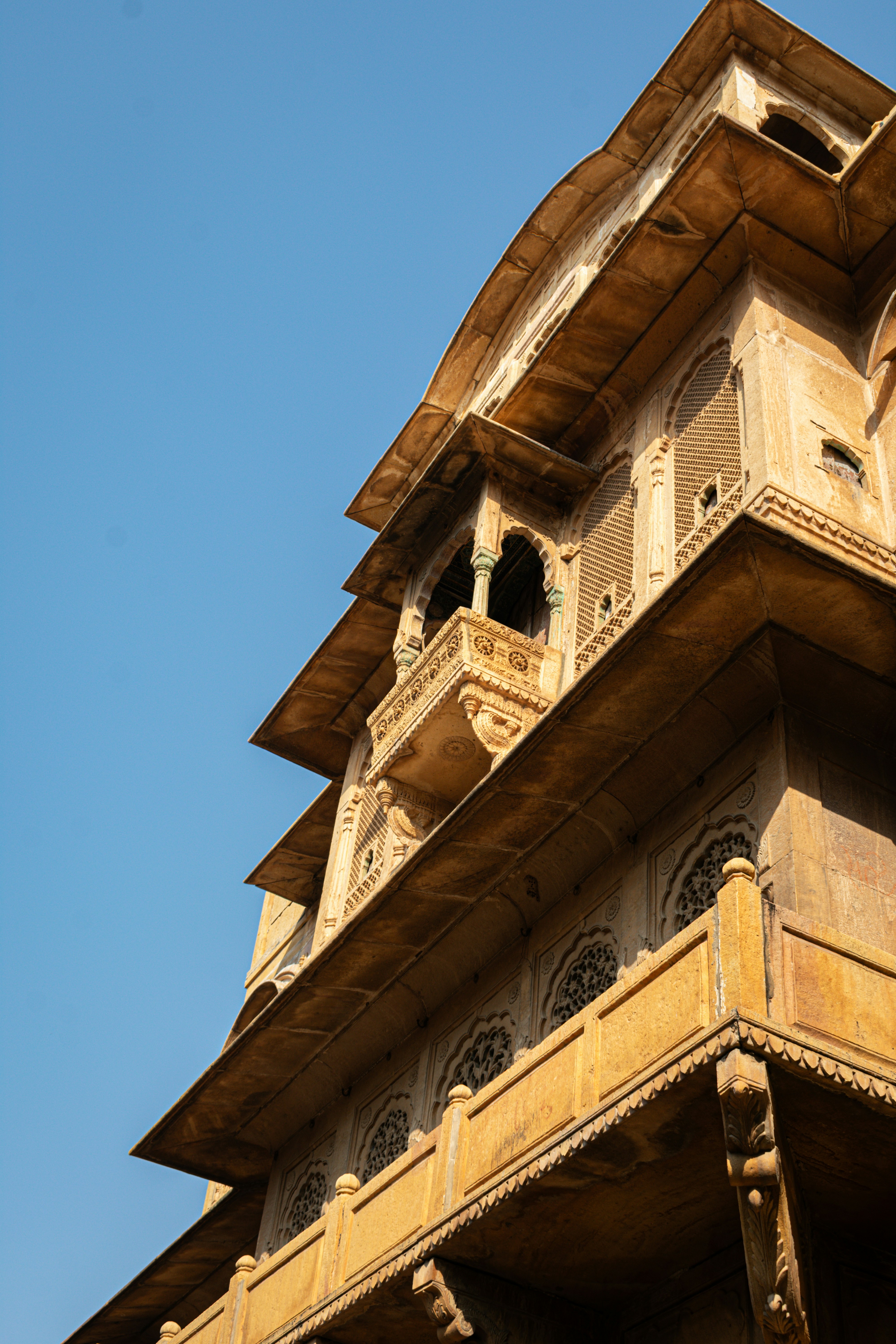 Sunlit Balconies: A Cornered View into Himalayan Stone Architecture