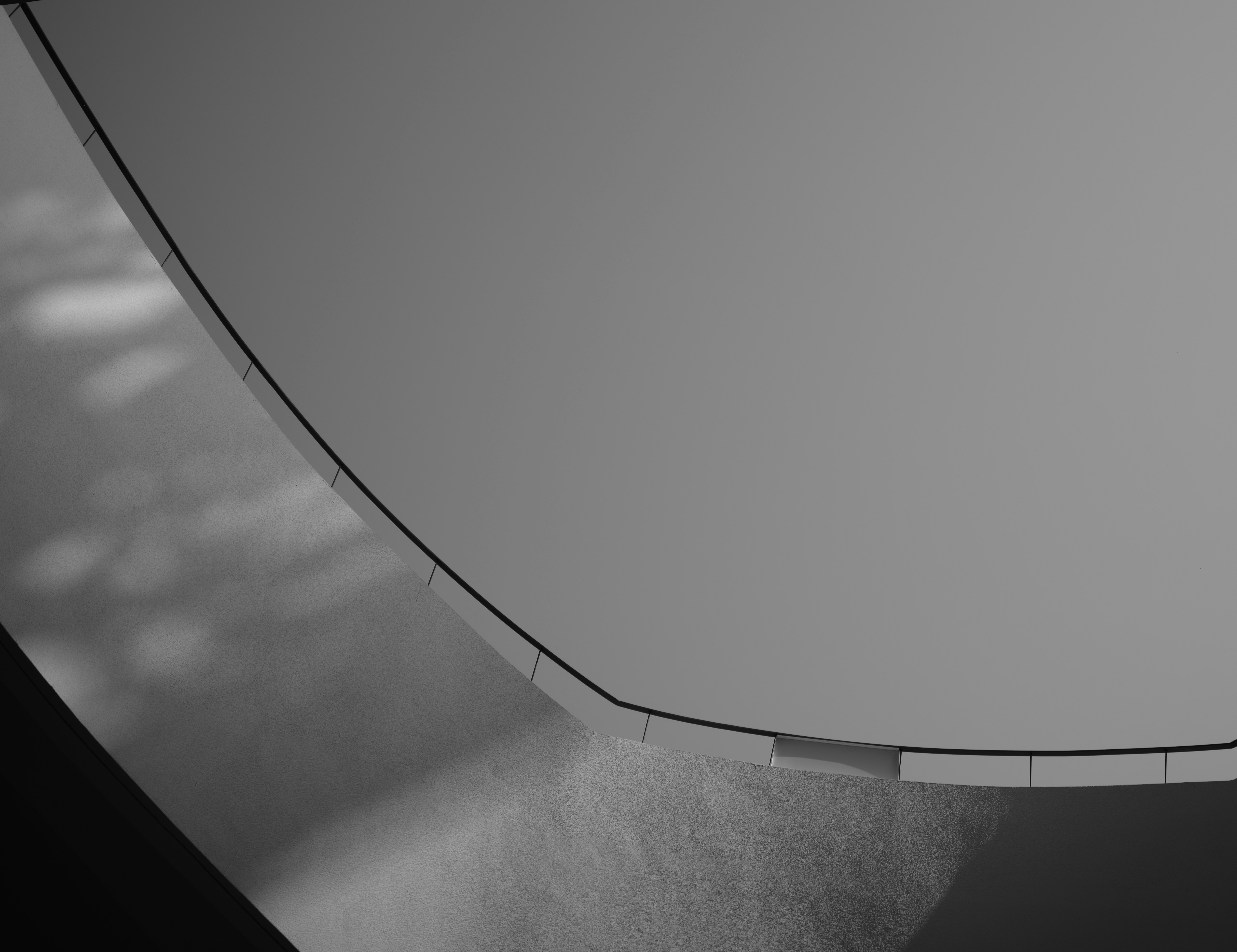 Curved Horizon: A Close-Up of an Aircraft Window Edge as Architecture of Light