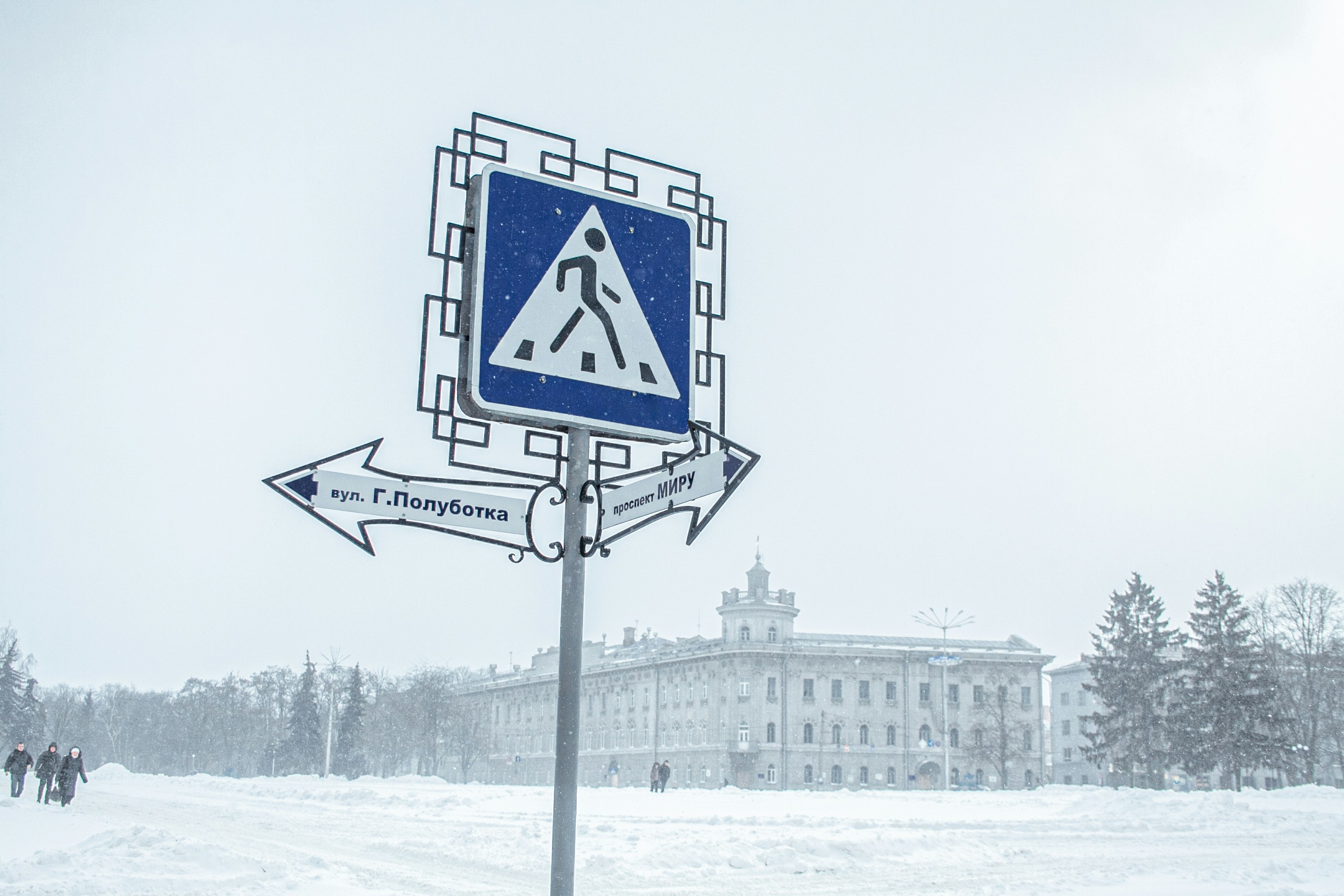 Winter Crosswalk Beacon Over Quiet Snowfield