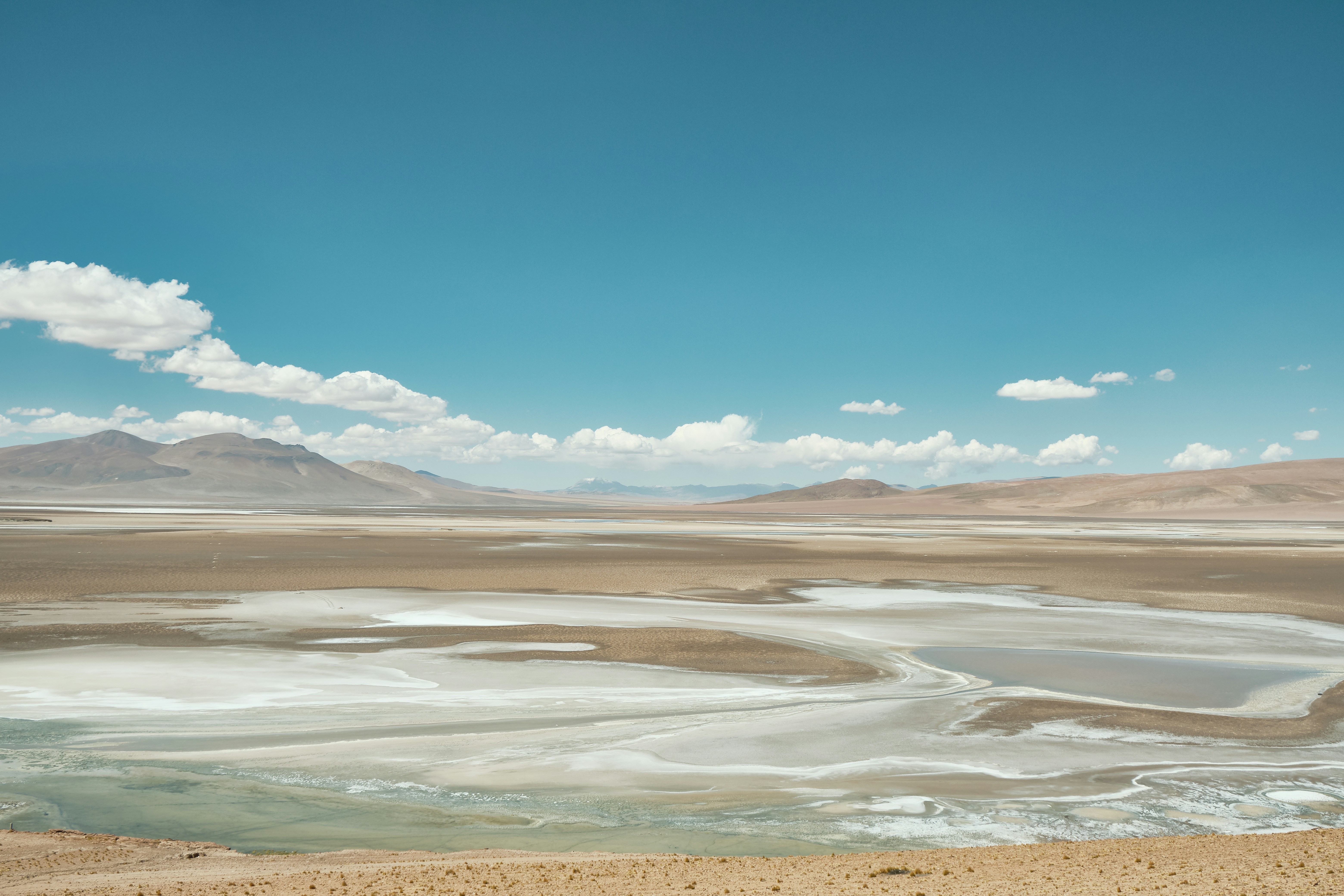 Salt Flats under a Cerulean Sky: A Quiet Desert Panorama