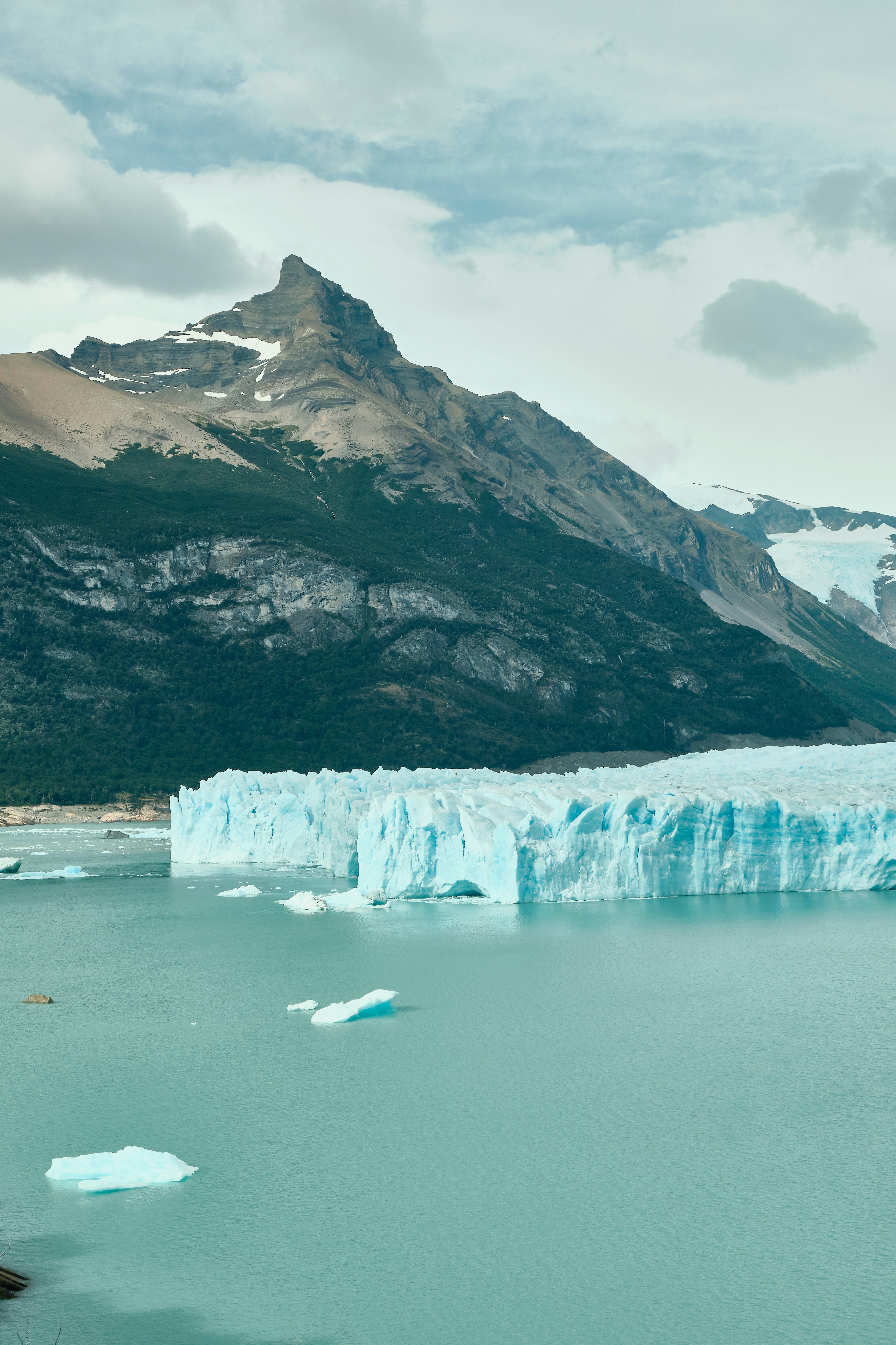 Glacial Edge Under Brighter Peaks