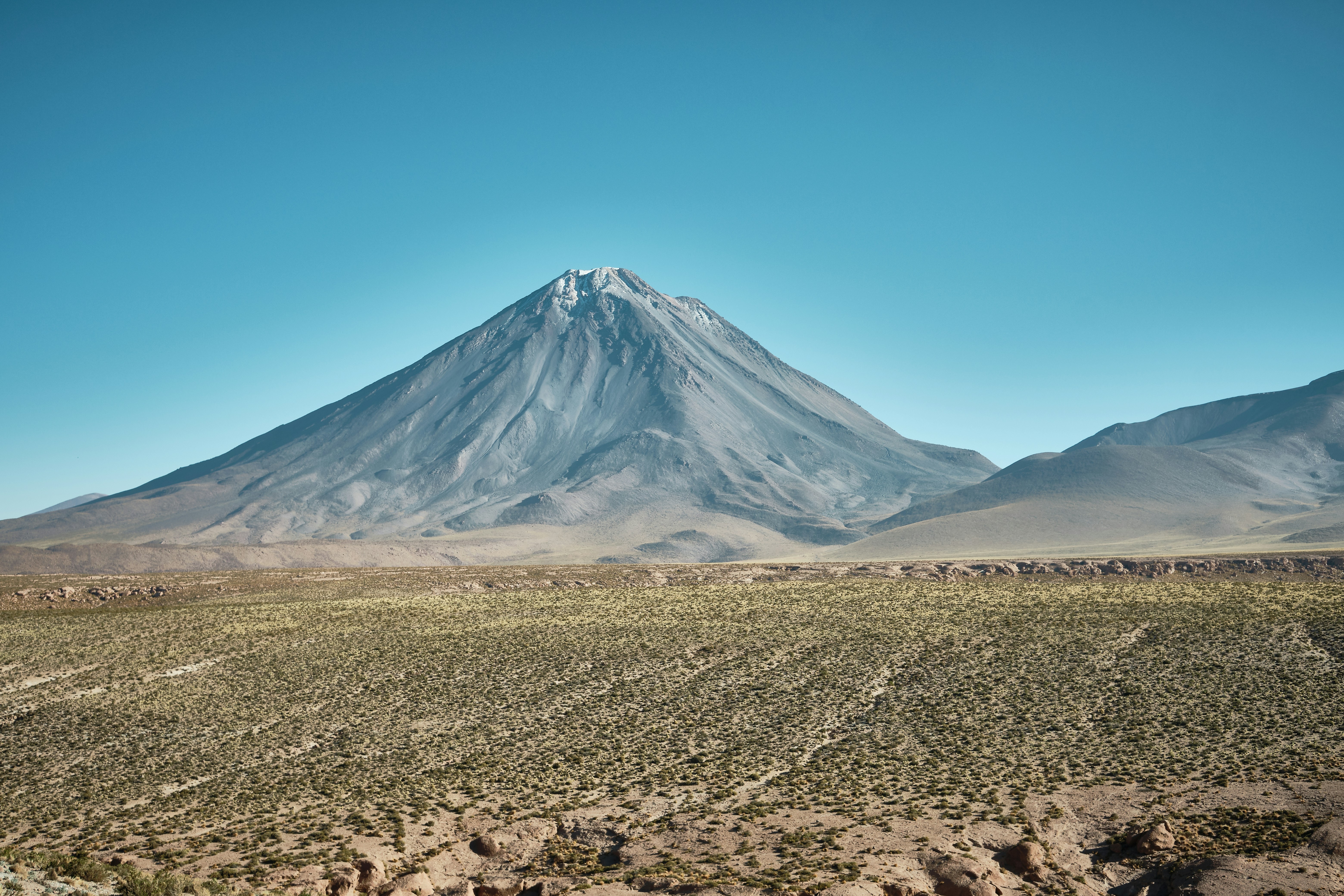 Snow-capped Volcano Crowned by A Clear Desert Sky