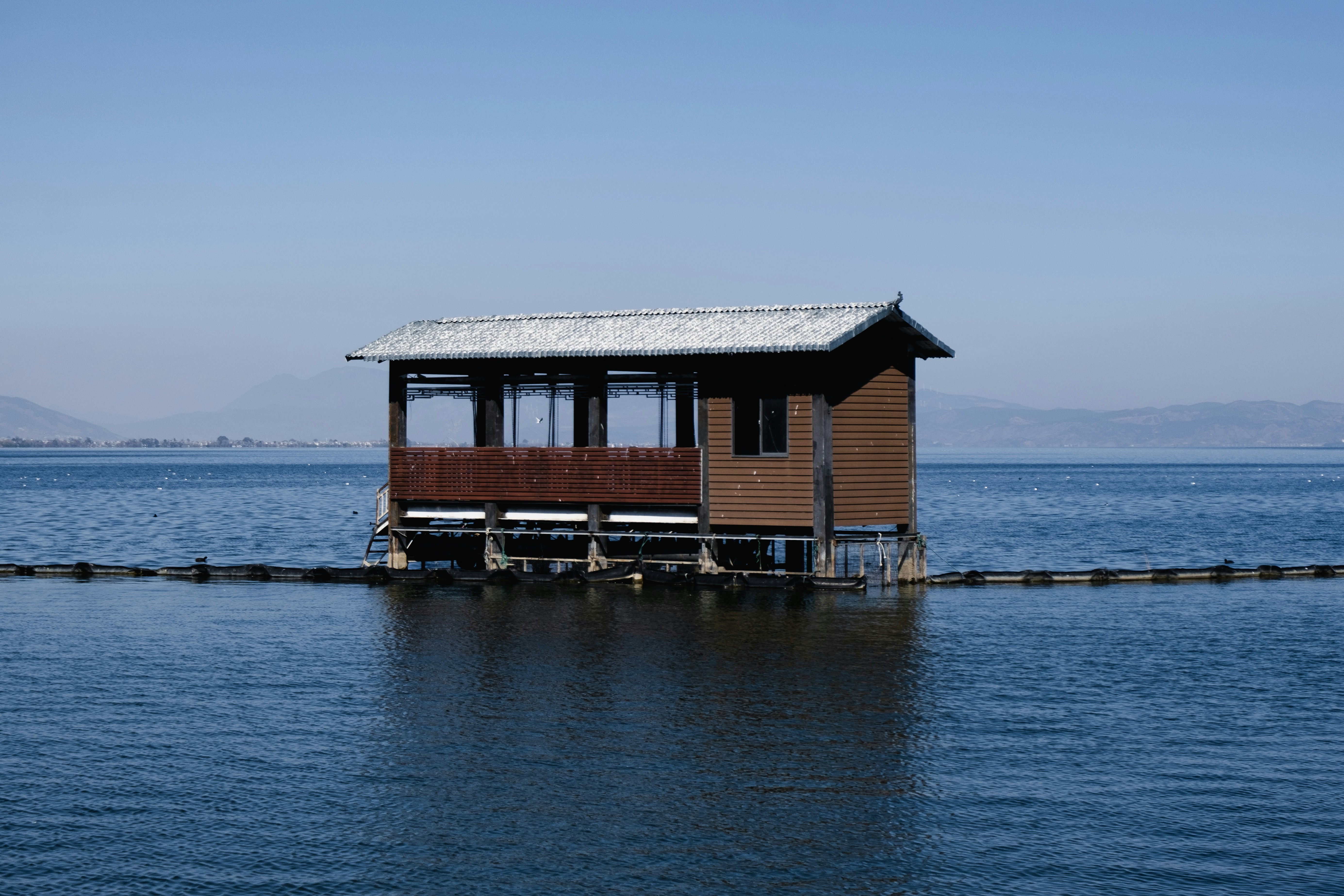 Floating Cabin on a Calm Sea