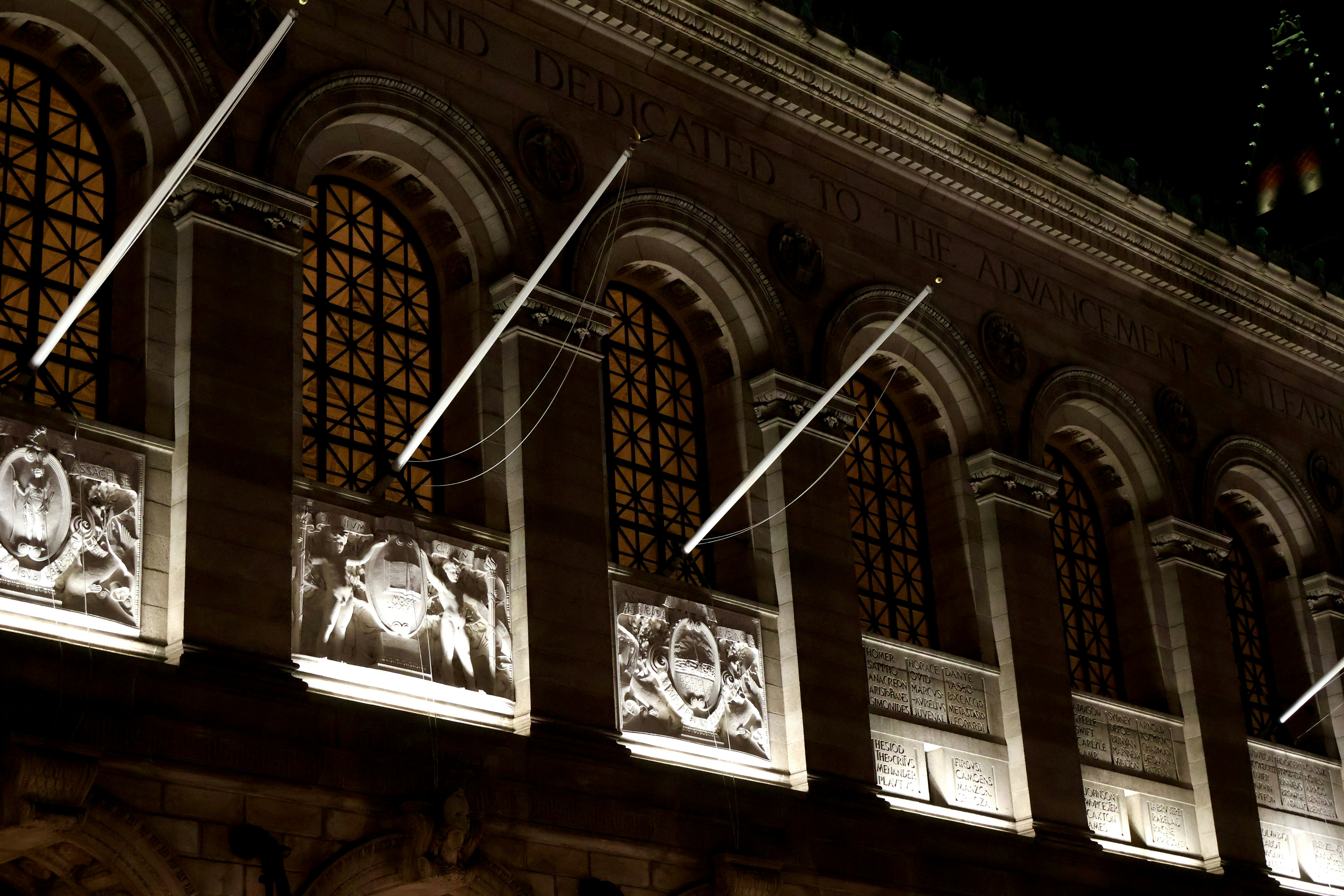 Ornate building facade with arched windows at night