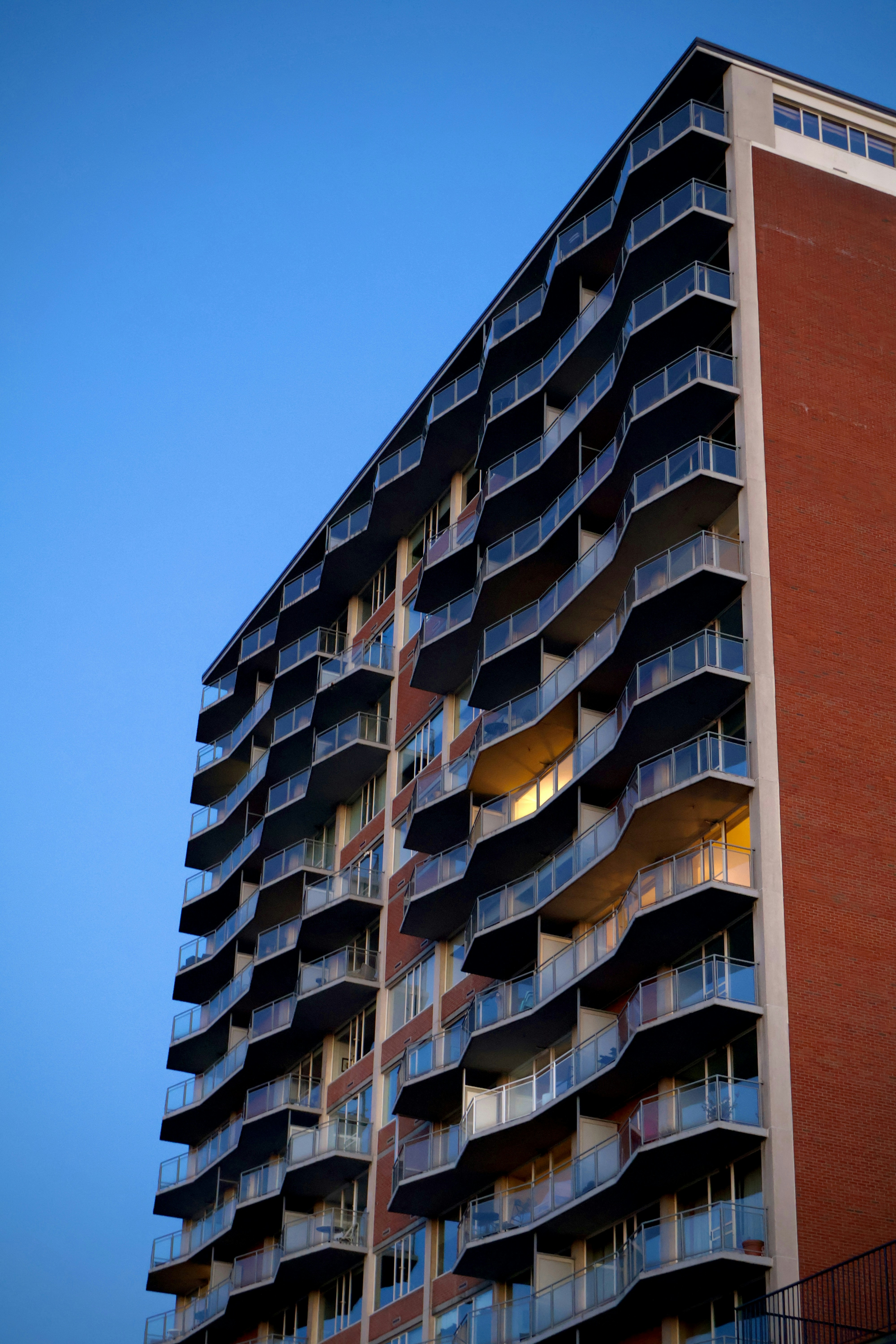 Balconied Facade Reaches for a Blue Sky