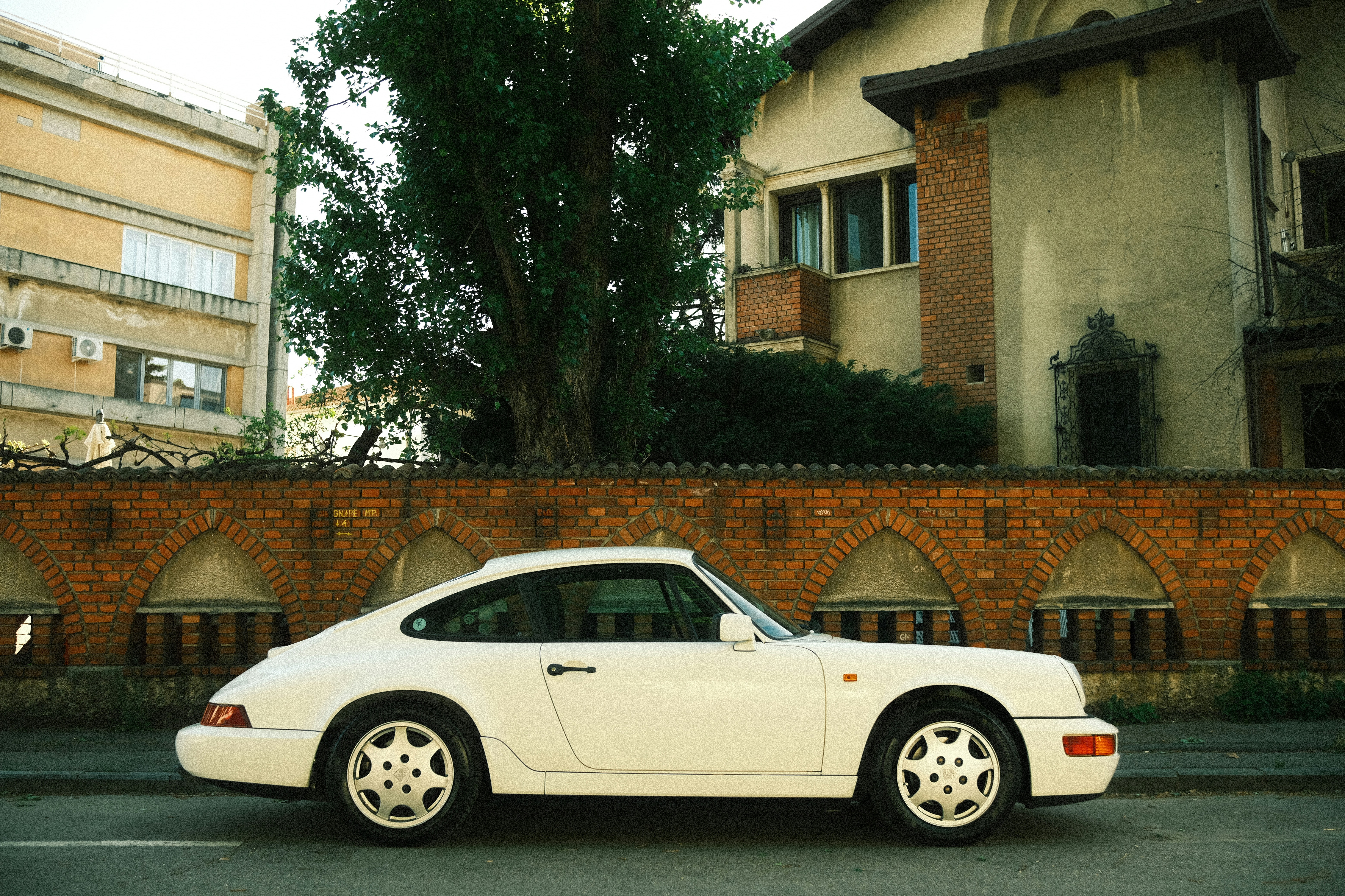 White Porsche Along a Quiet City Street