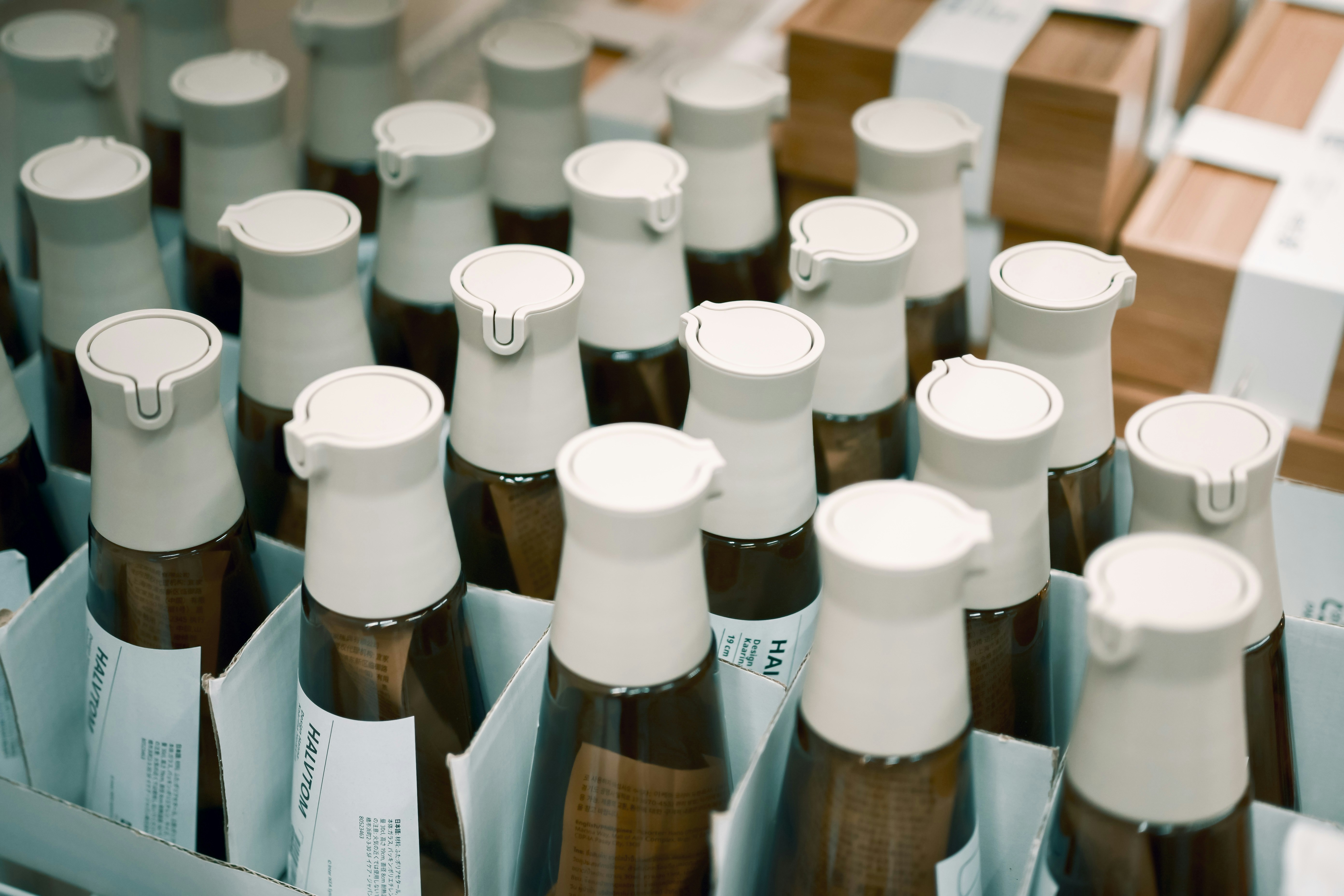 Queued Champagne Bottles: Neon Labels in a Cold Display