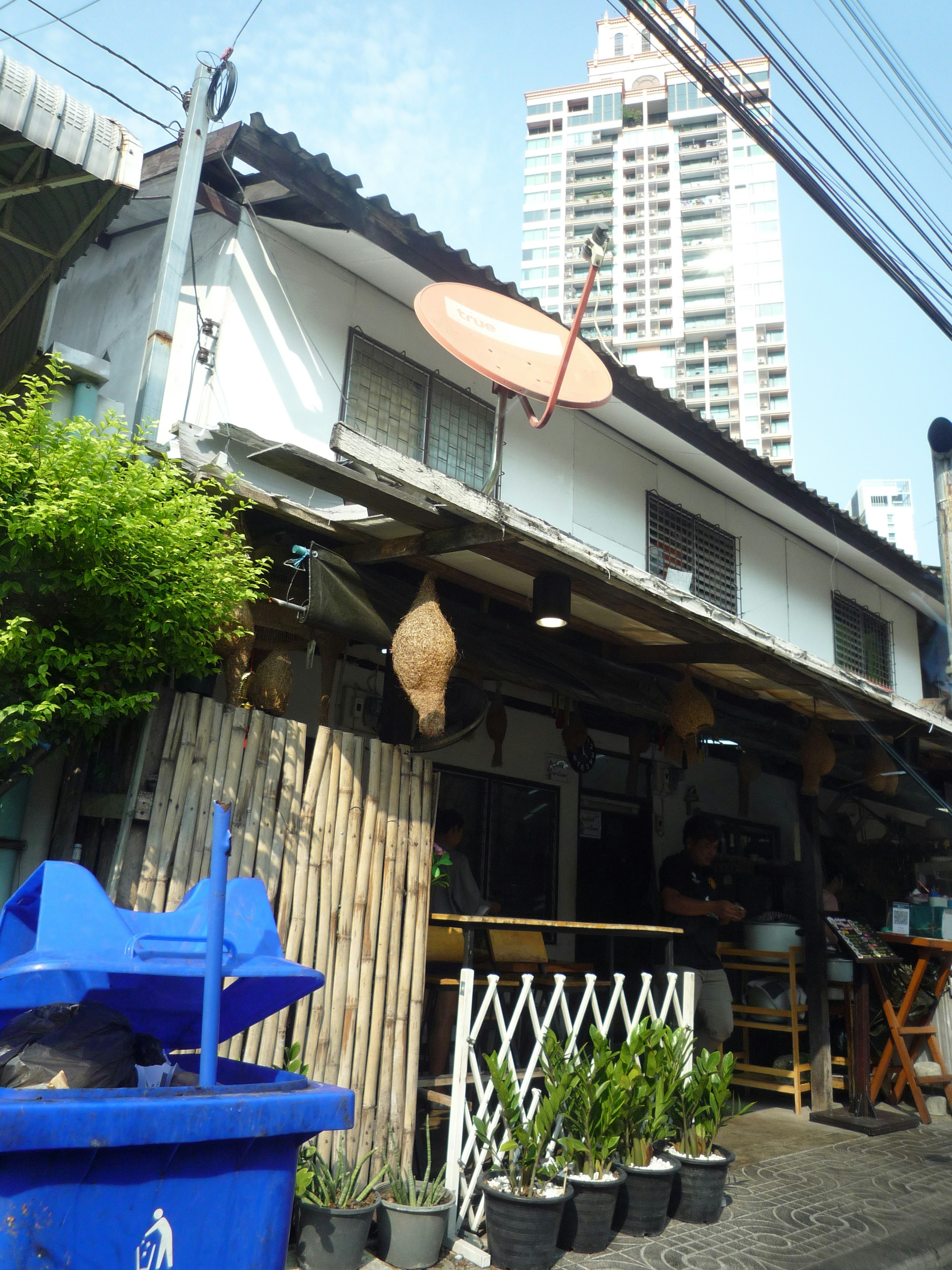 Satellite Dish Over a Streetfront Café