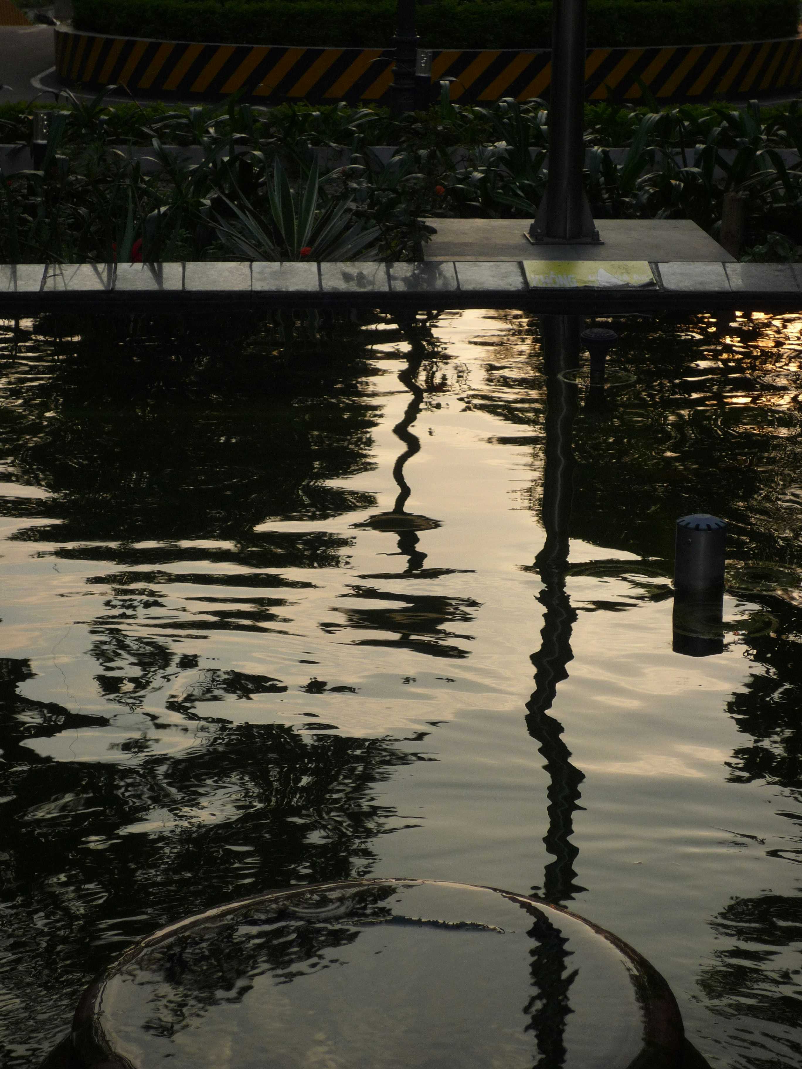 Silent reflections on a sunlit canal
