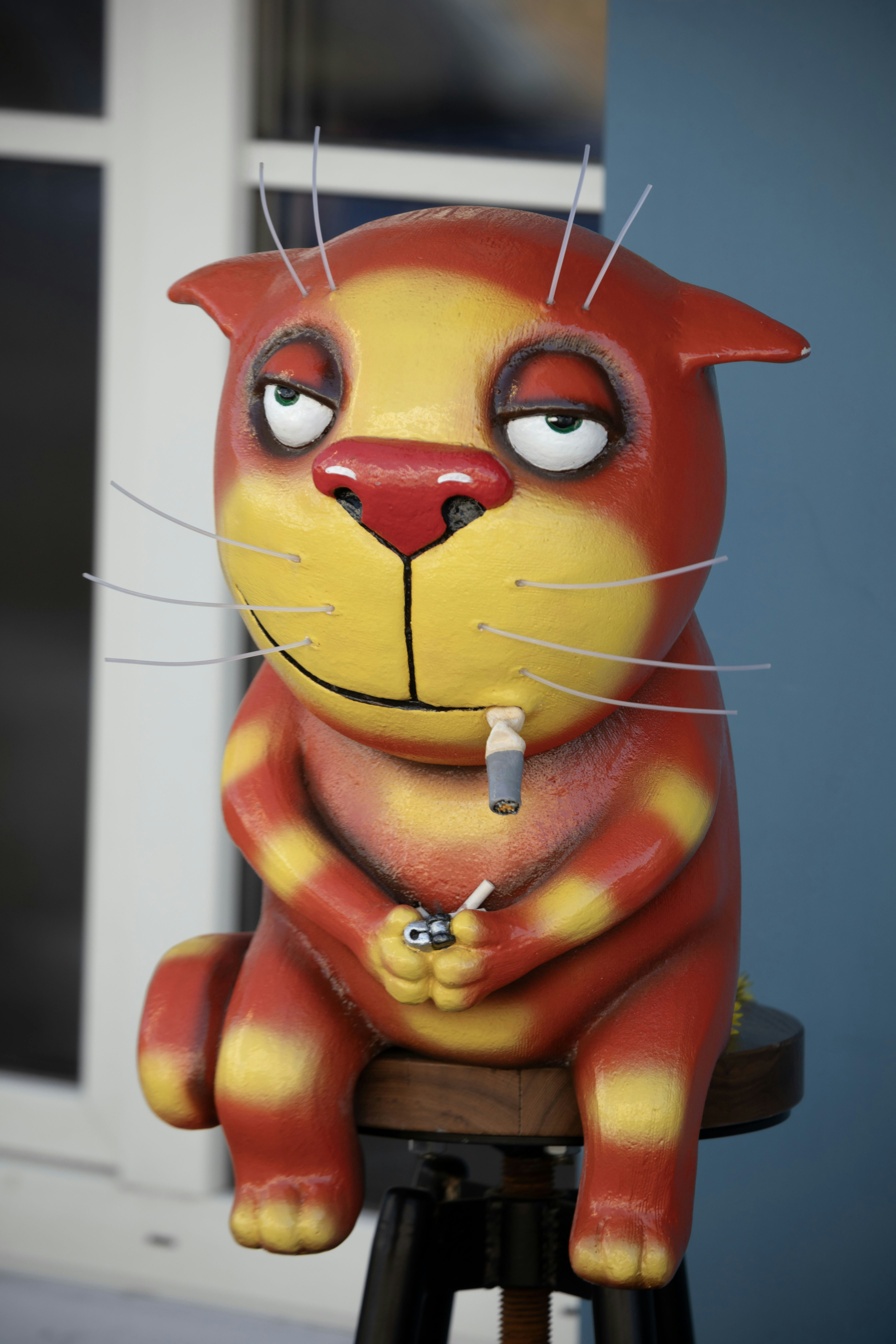 Sunlit Smirk: A Lip-Cigarette Mascot in Bold Red