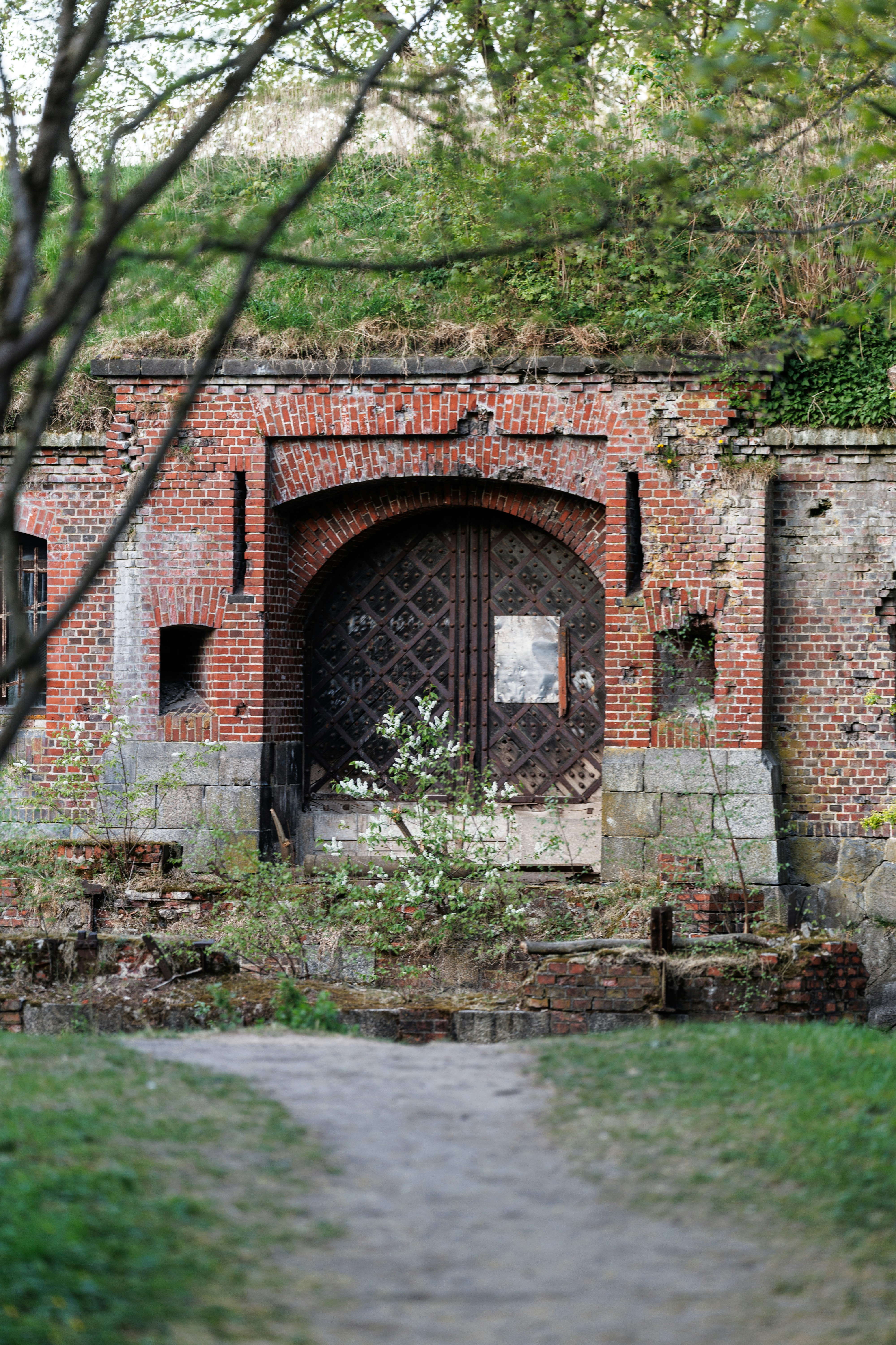 Brick Archway Gateway Framed by Overgrown Garden Path