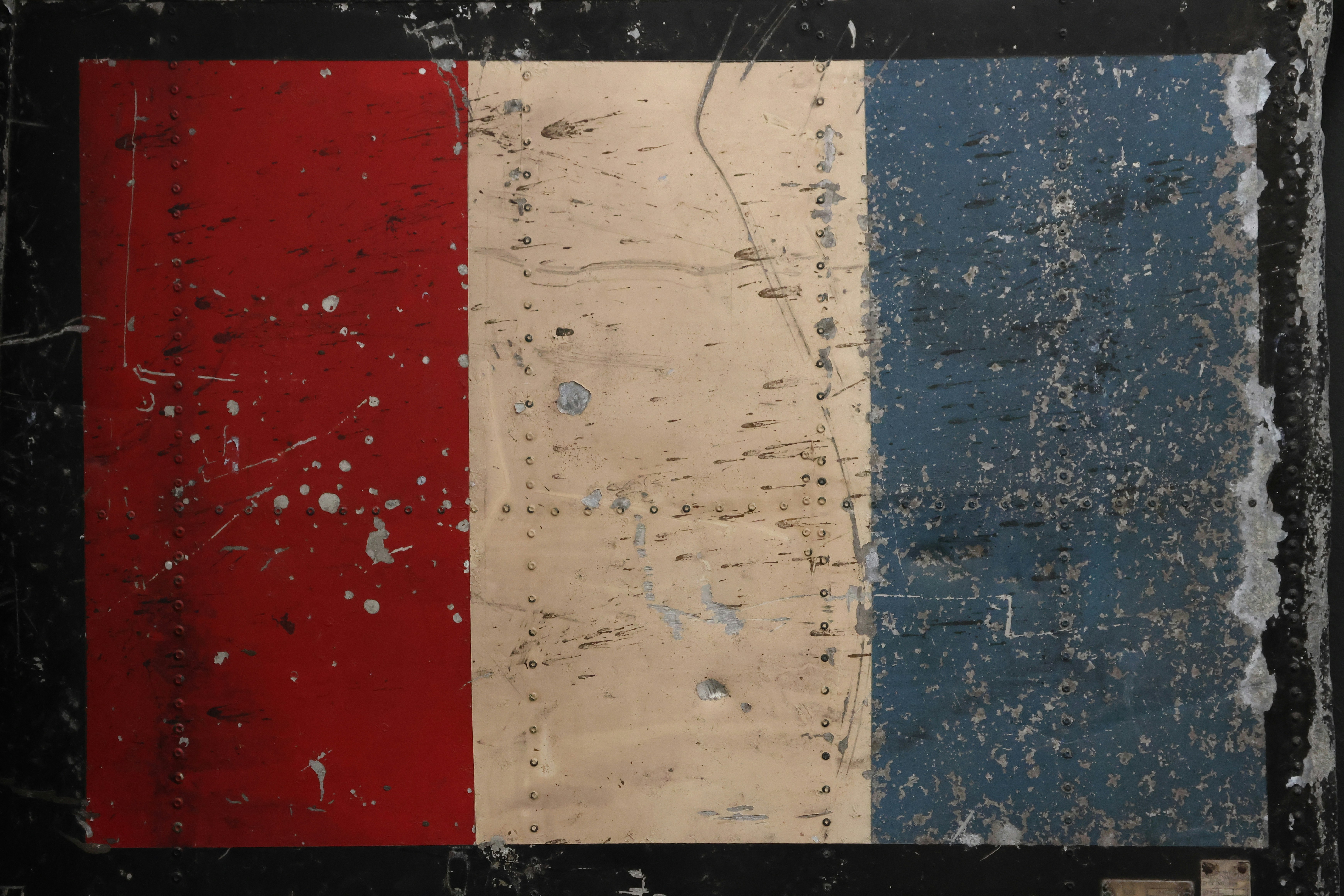 Three-Paneled Weathered Sign: Red, White, and Blue Stripes