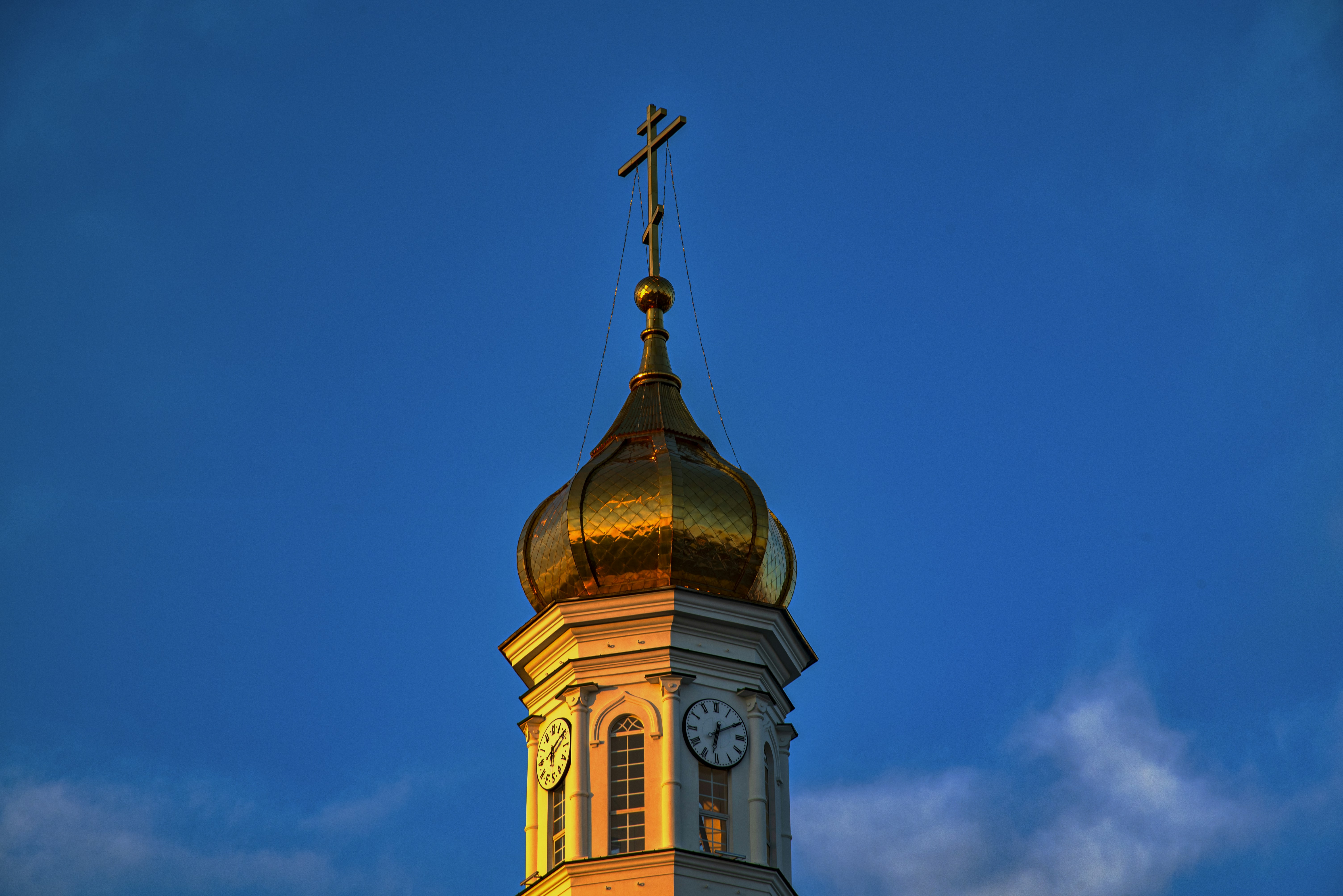 Golden Cupola Rising Above a Clear Blue Sky