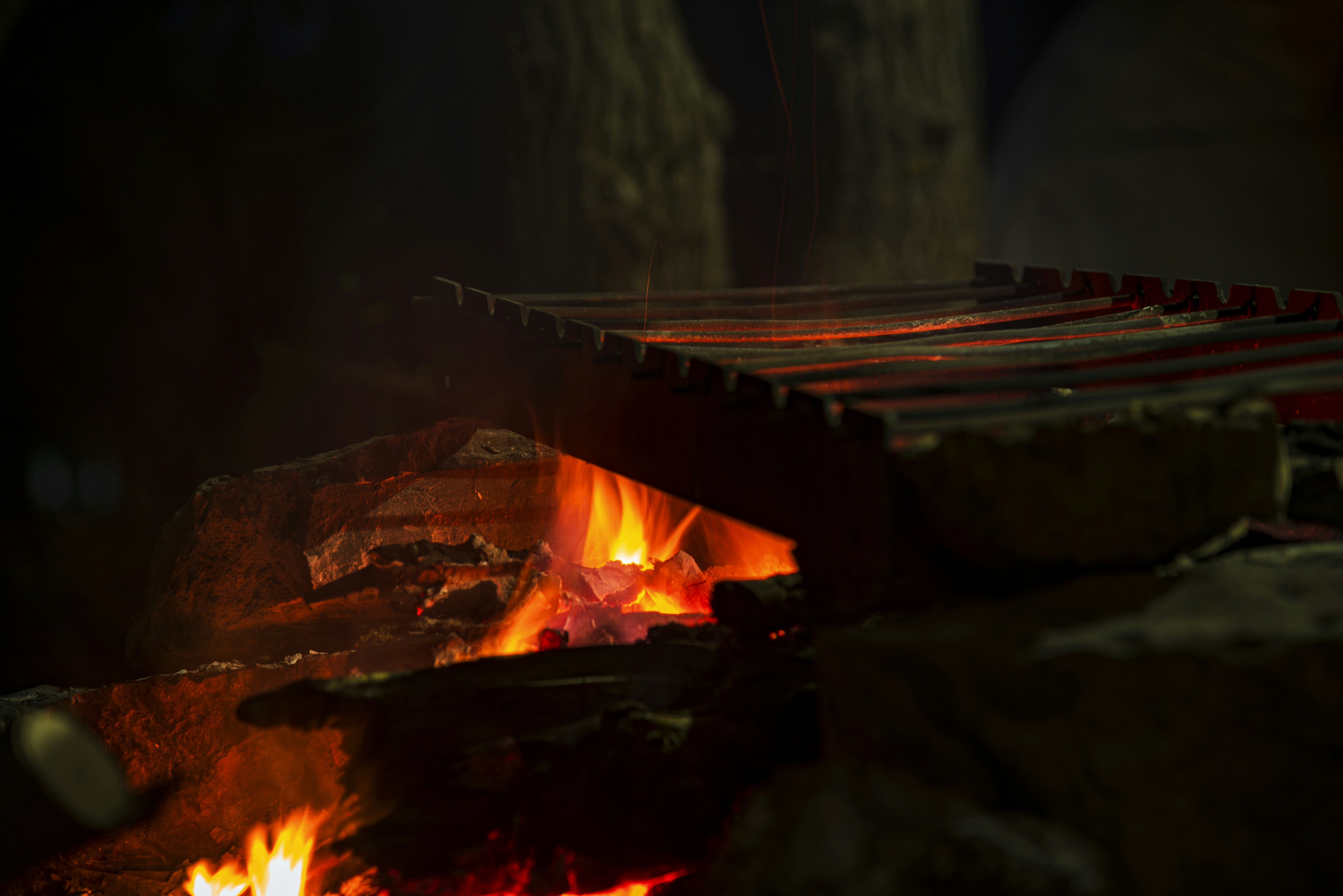 Embers Under a Grate: Night Firelight on Rough Logs