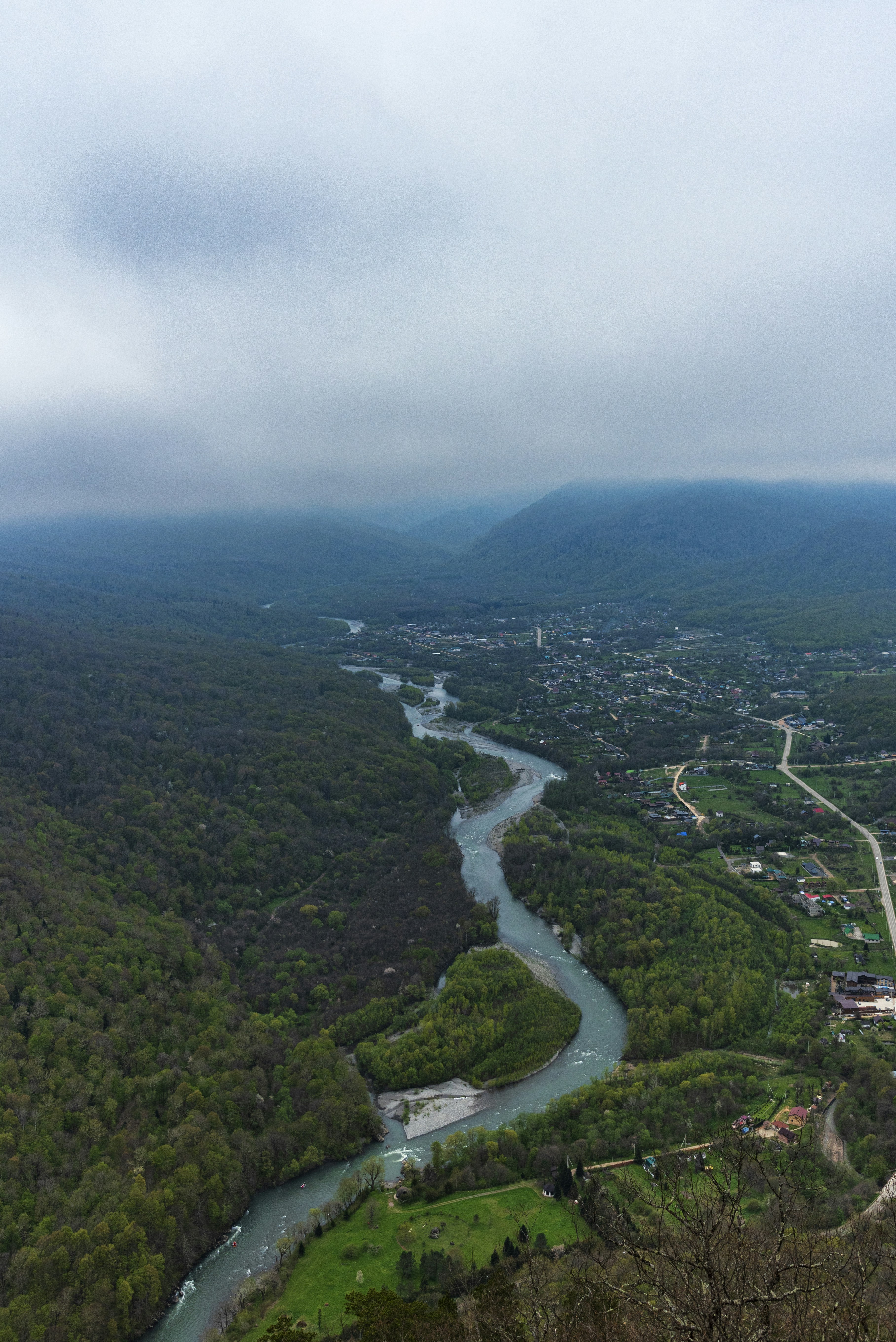 Meandering River Carving Through Emerald Valley