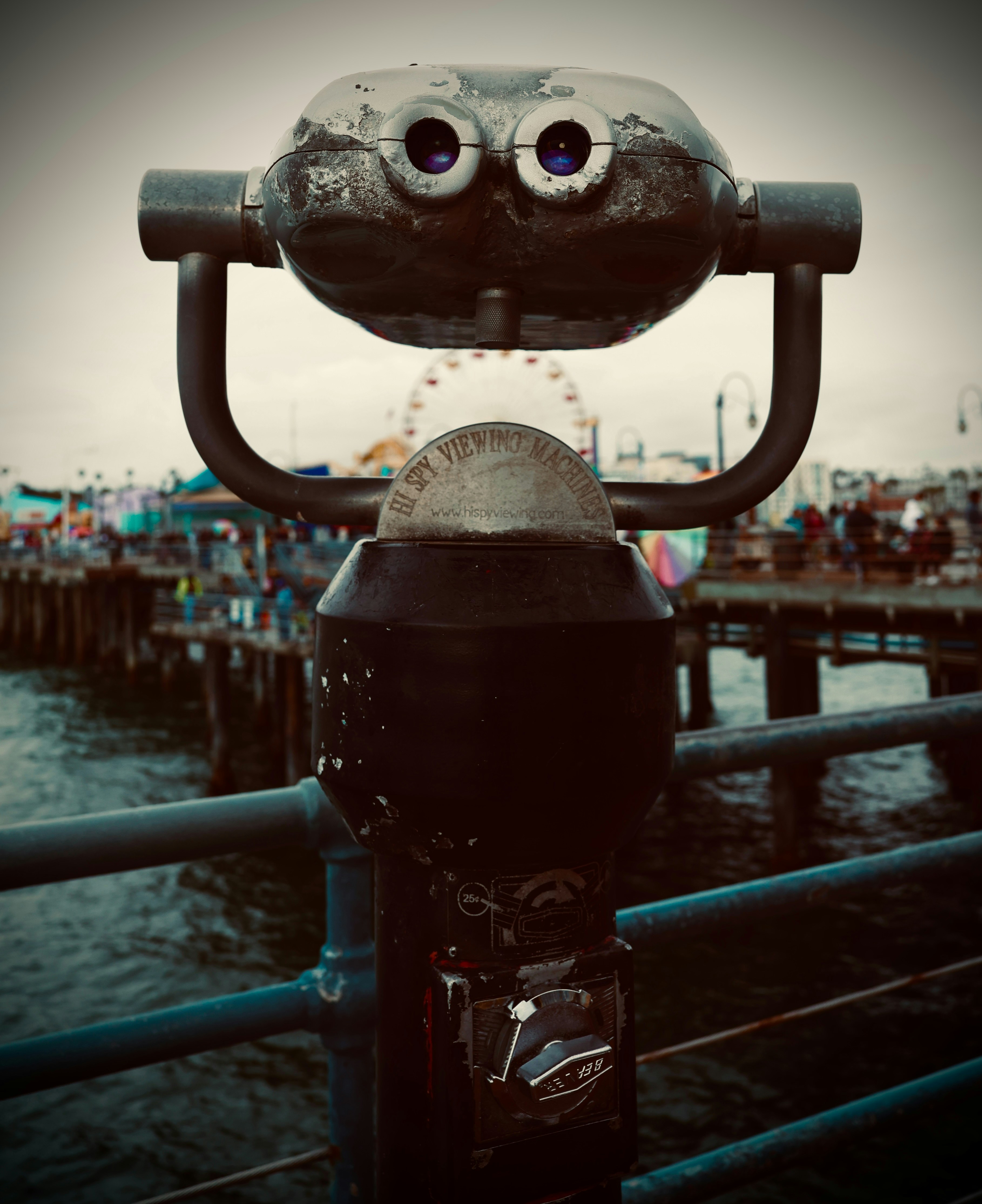 Coin-operated Lens of the Pier: A Playful View Through a Weathered Scope
