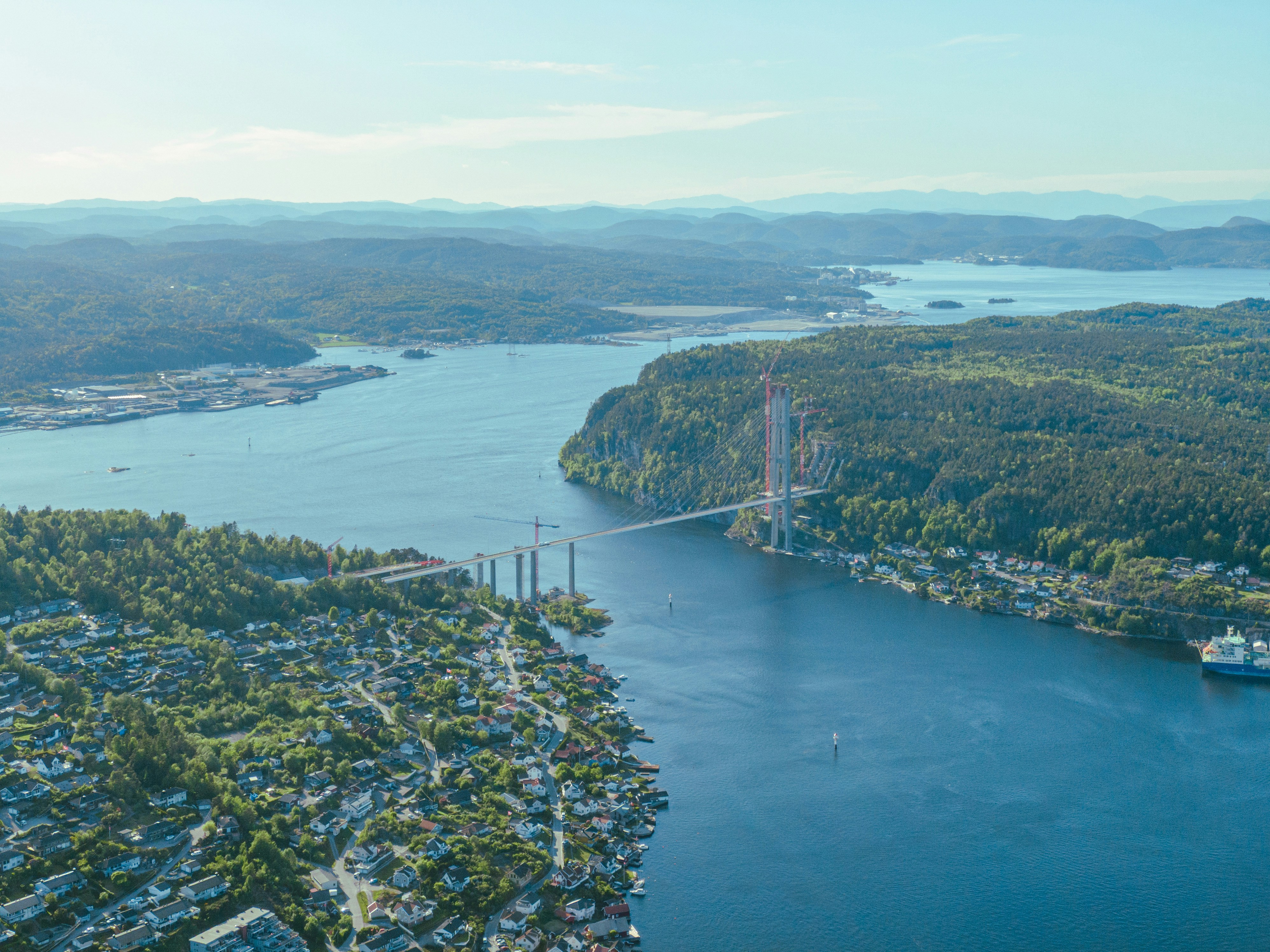 Suspended Span Over Quiet Fjord: Aerial View of a Serene Waterway