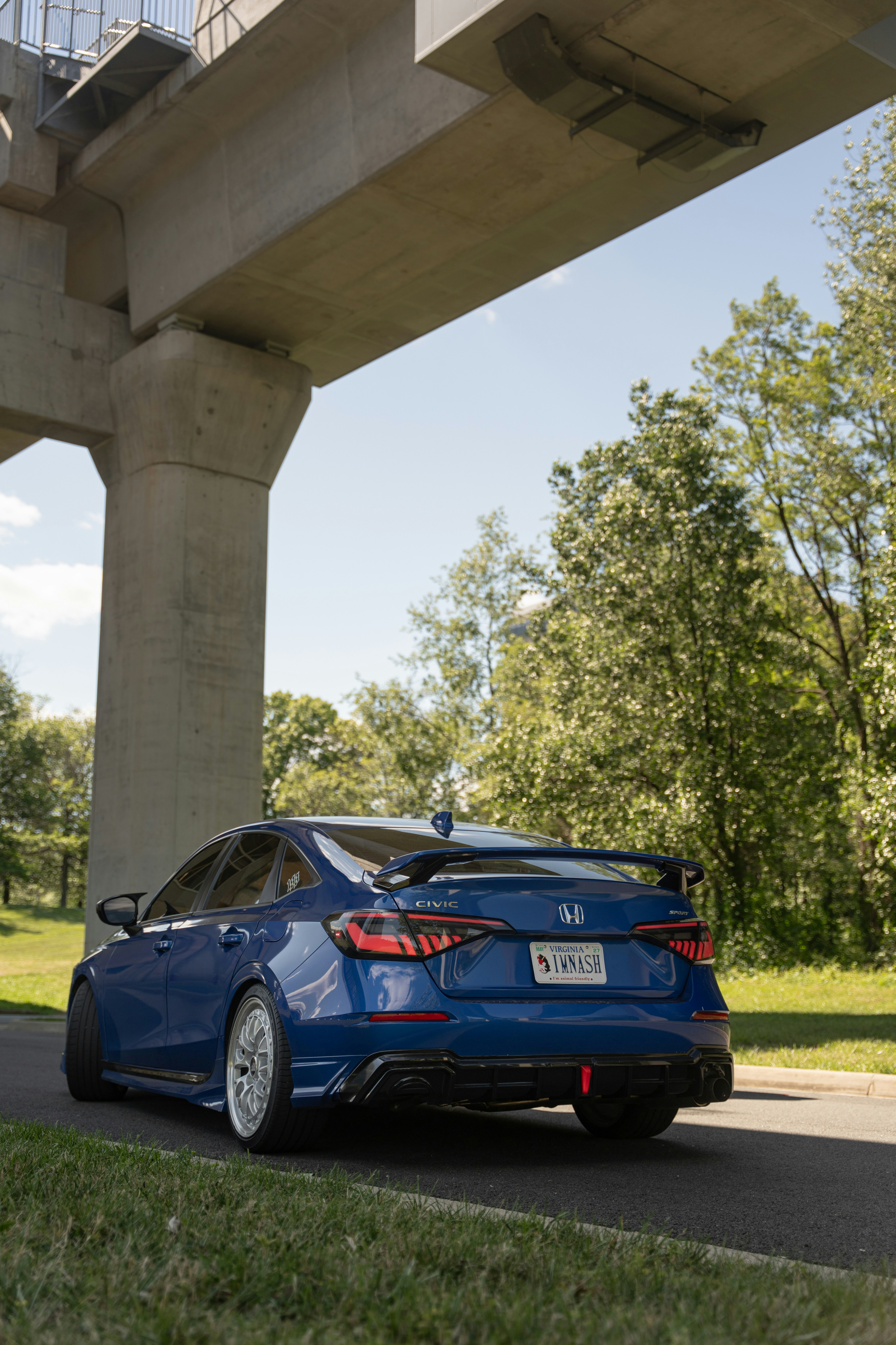 Blue Civic Beneath Concrete Arches