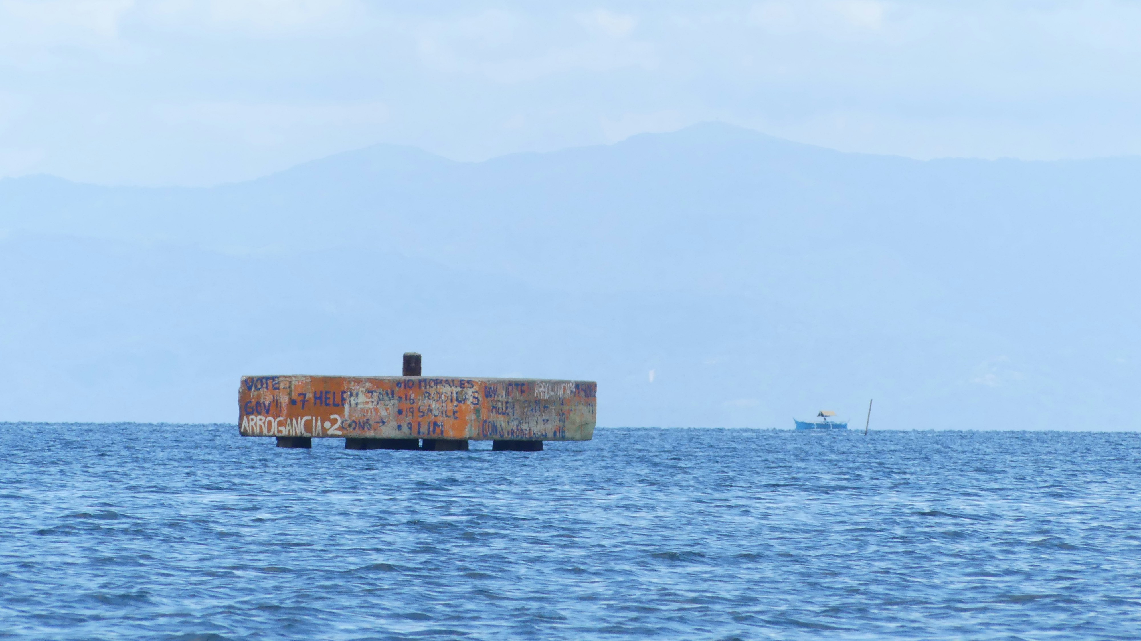 Rusting buoy Amid the Pacific Horizon