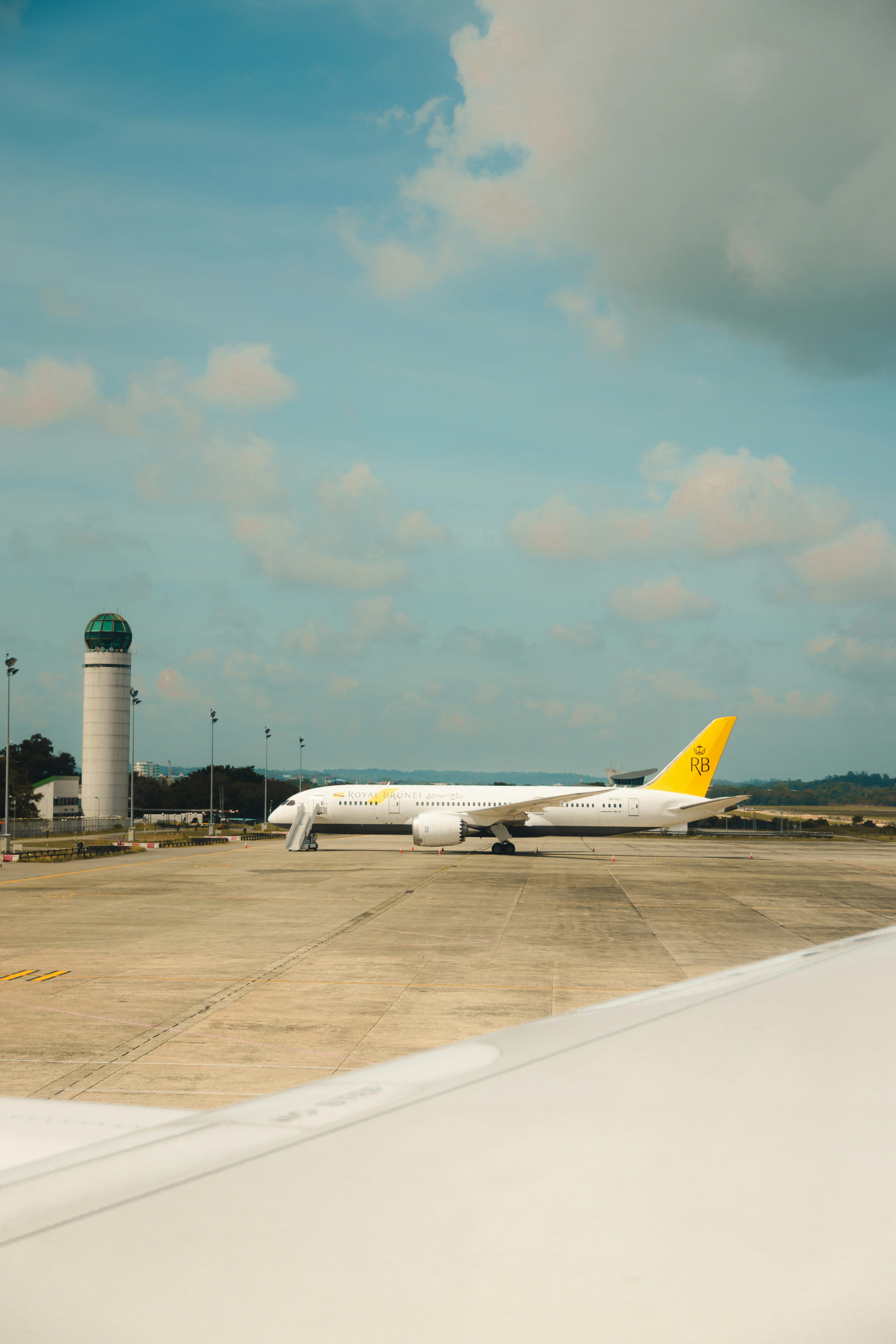 Yellow-tail Jet on the Quiet Taxiway at Sunset Light
