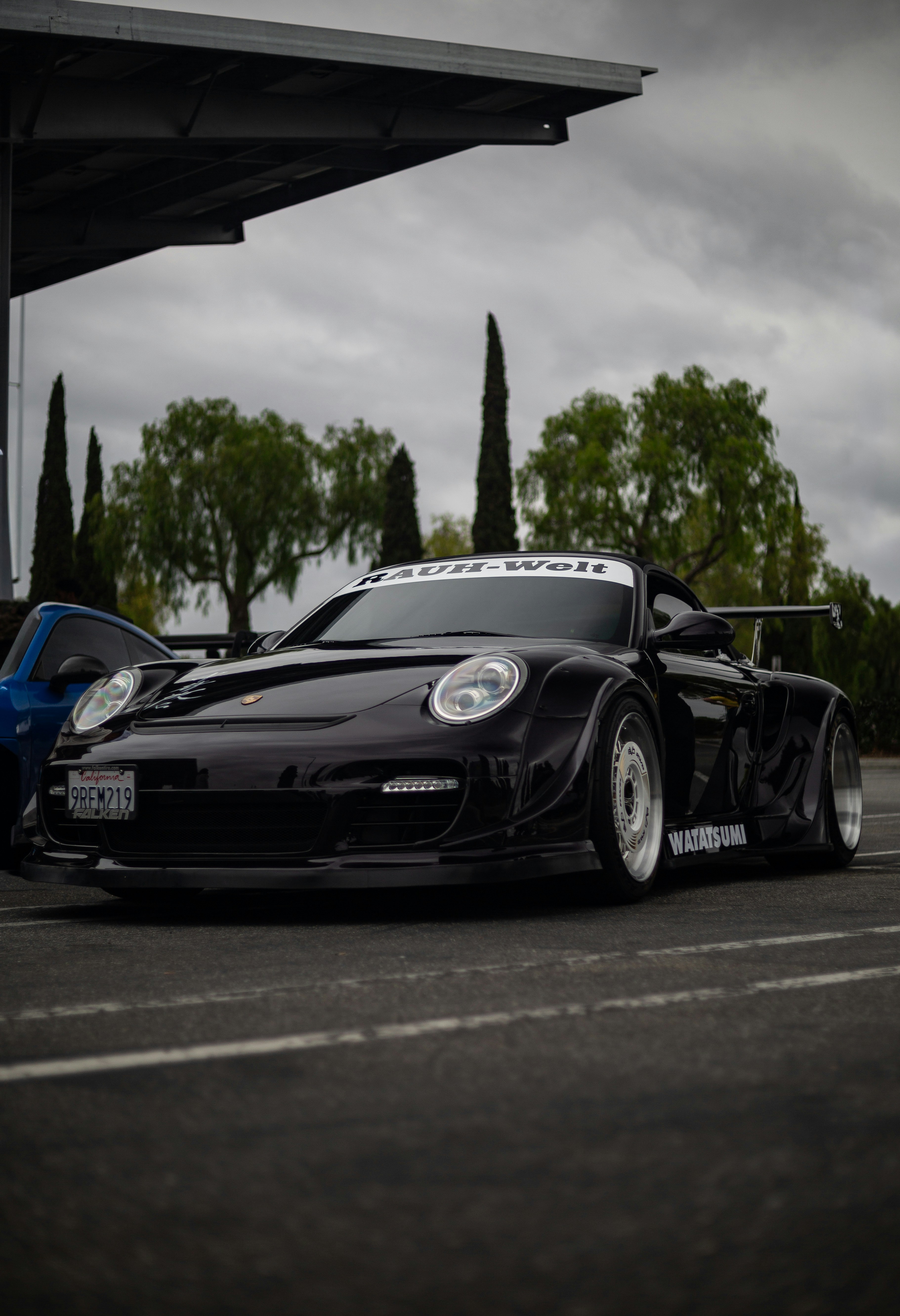 Black Porsche Drift Car at a Show: Low Angle, High Attitude
