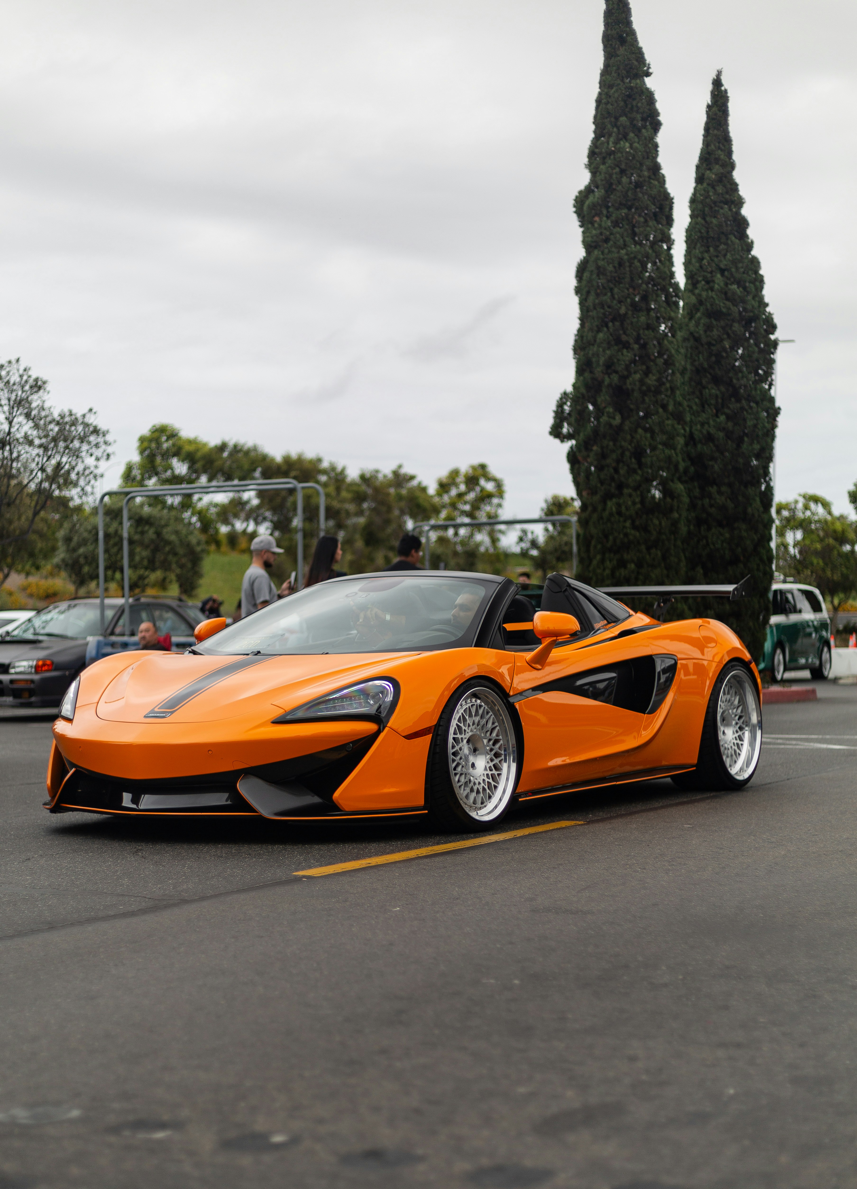 Orange McLaren Roadster in a Parking Lot Spotlight
