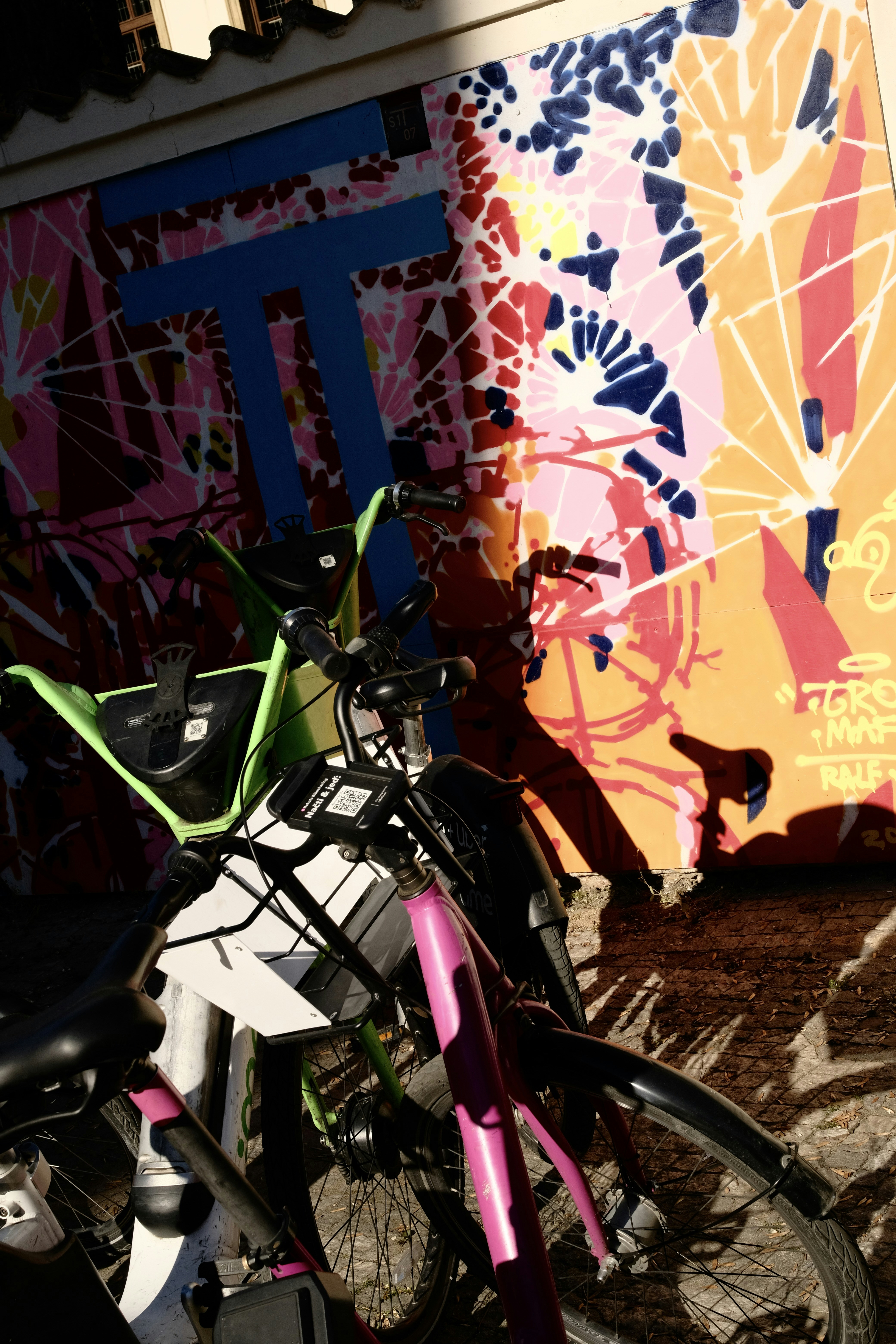 Vivid City Bicycles Against a Graffiti Burst