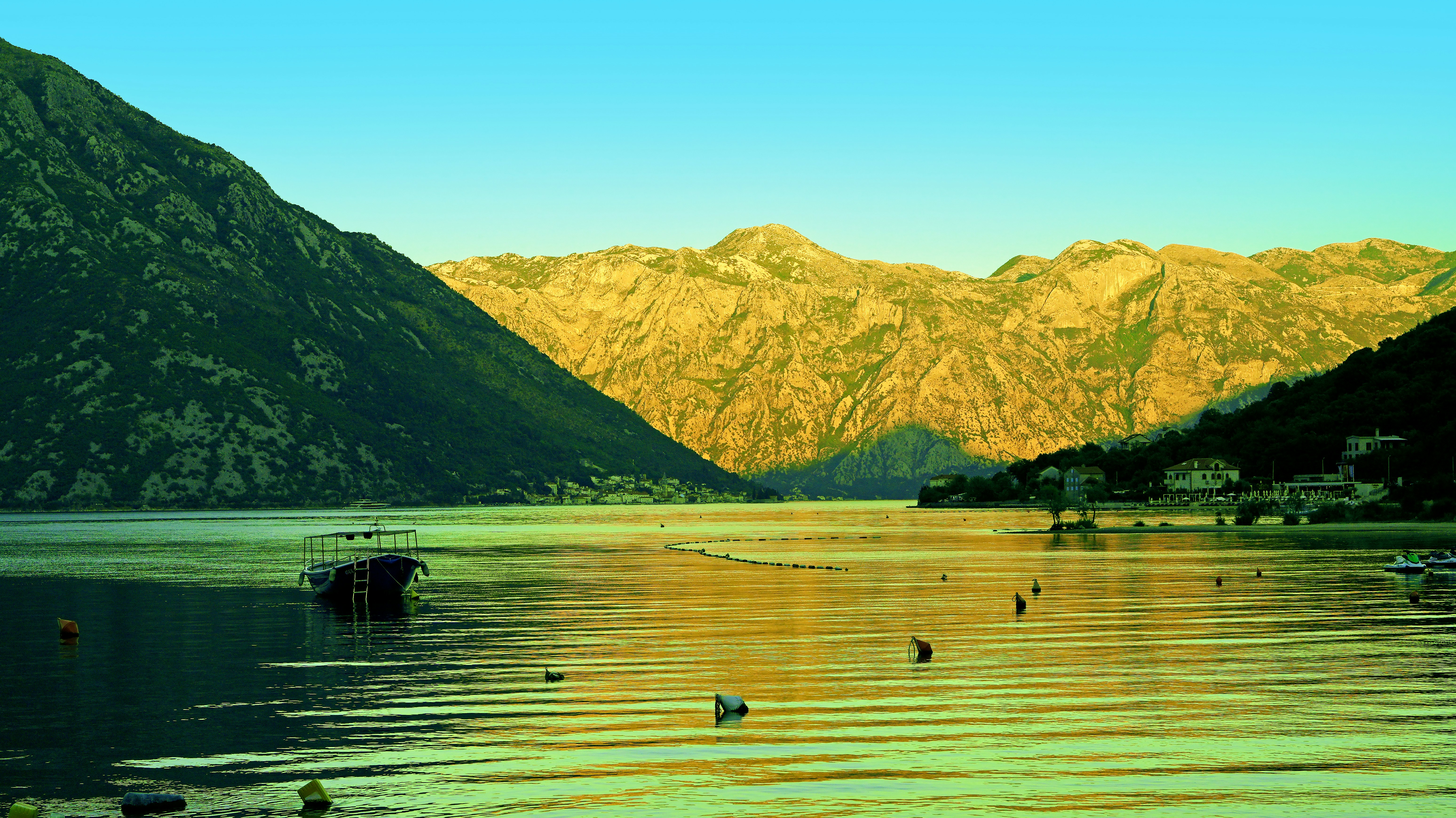 Golden Fjord: Mountain Rim Reflects on a Quiet Lake