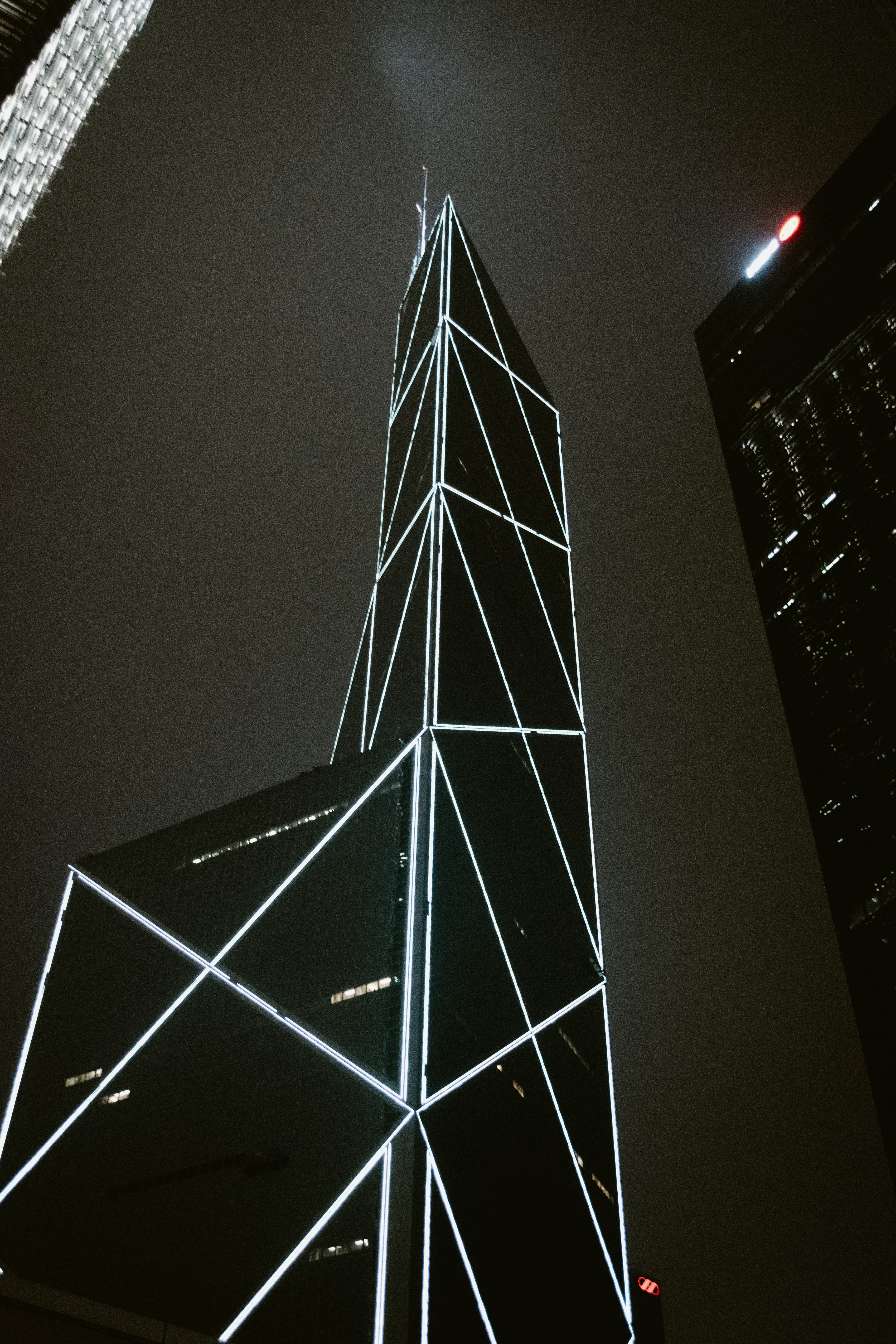 Vertical Geometry: Night Skyline Illuminates Steel Lattice