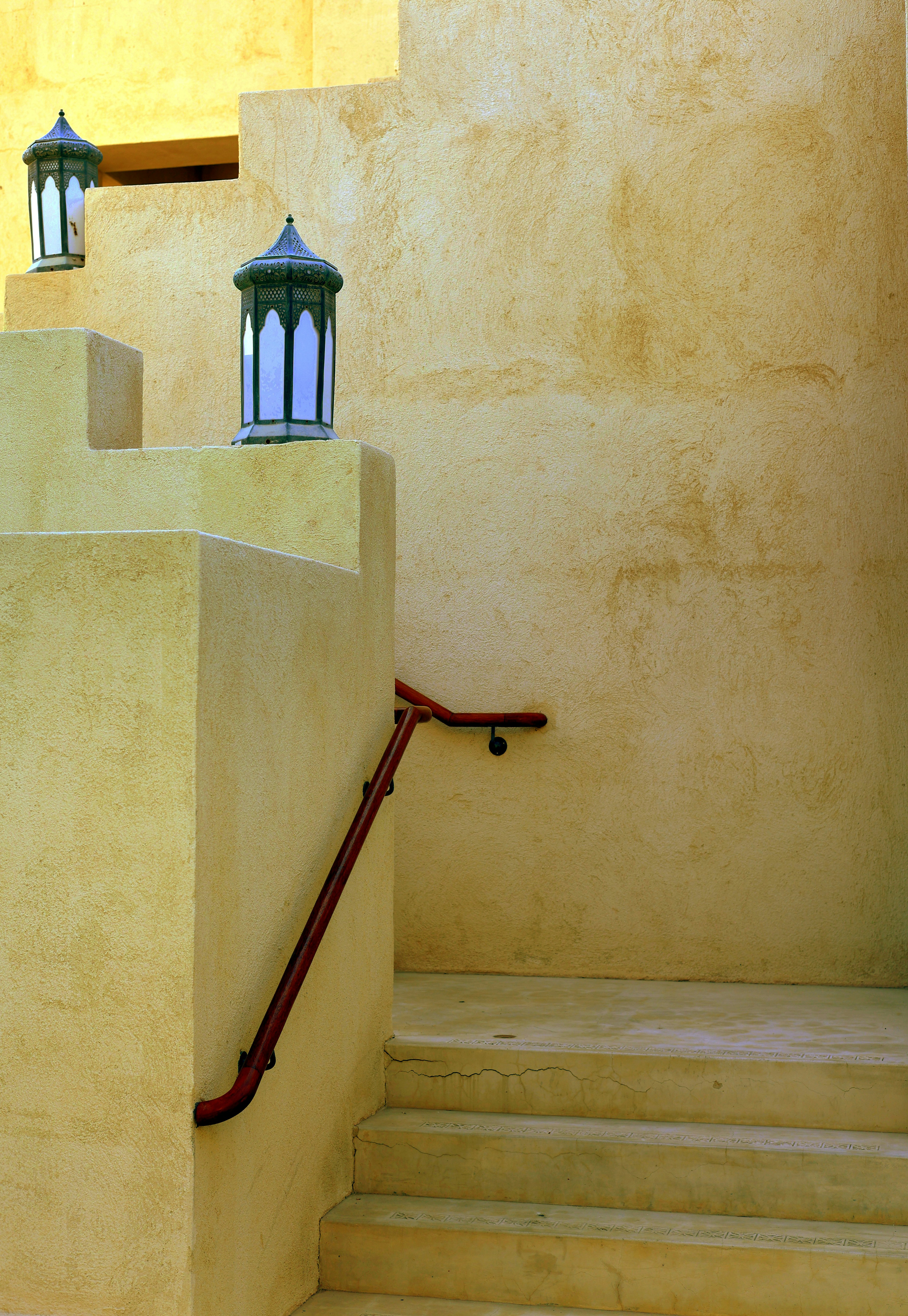 Deserted Stairway Lanterns on Warm Yellow Courtyard