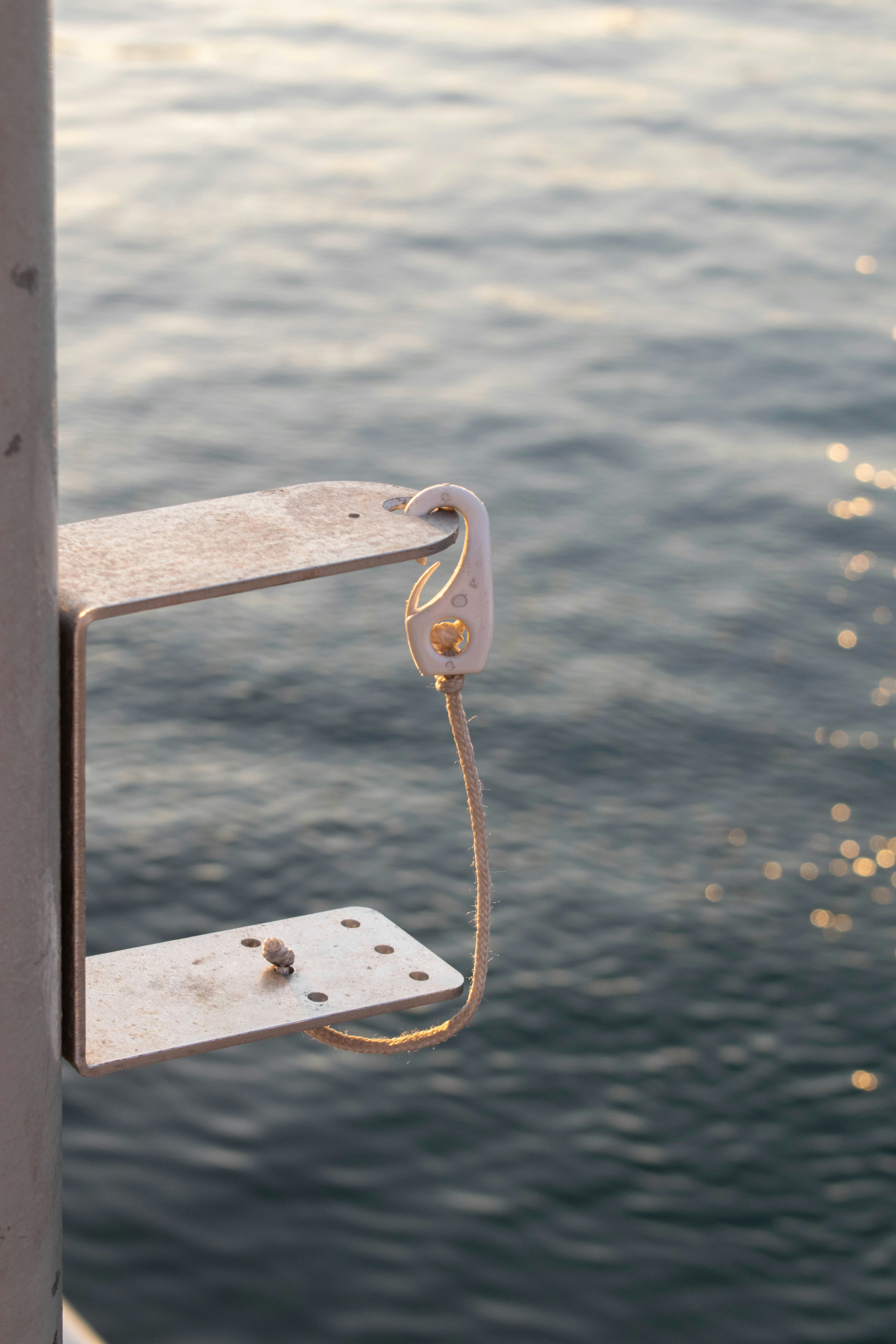 Rusted Mooring Hook on a Quiet Marina Slip