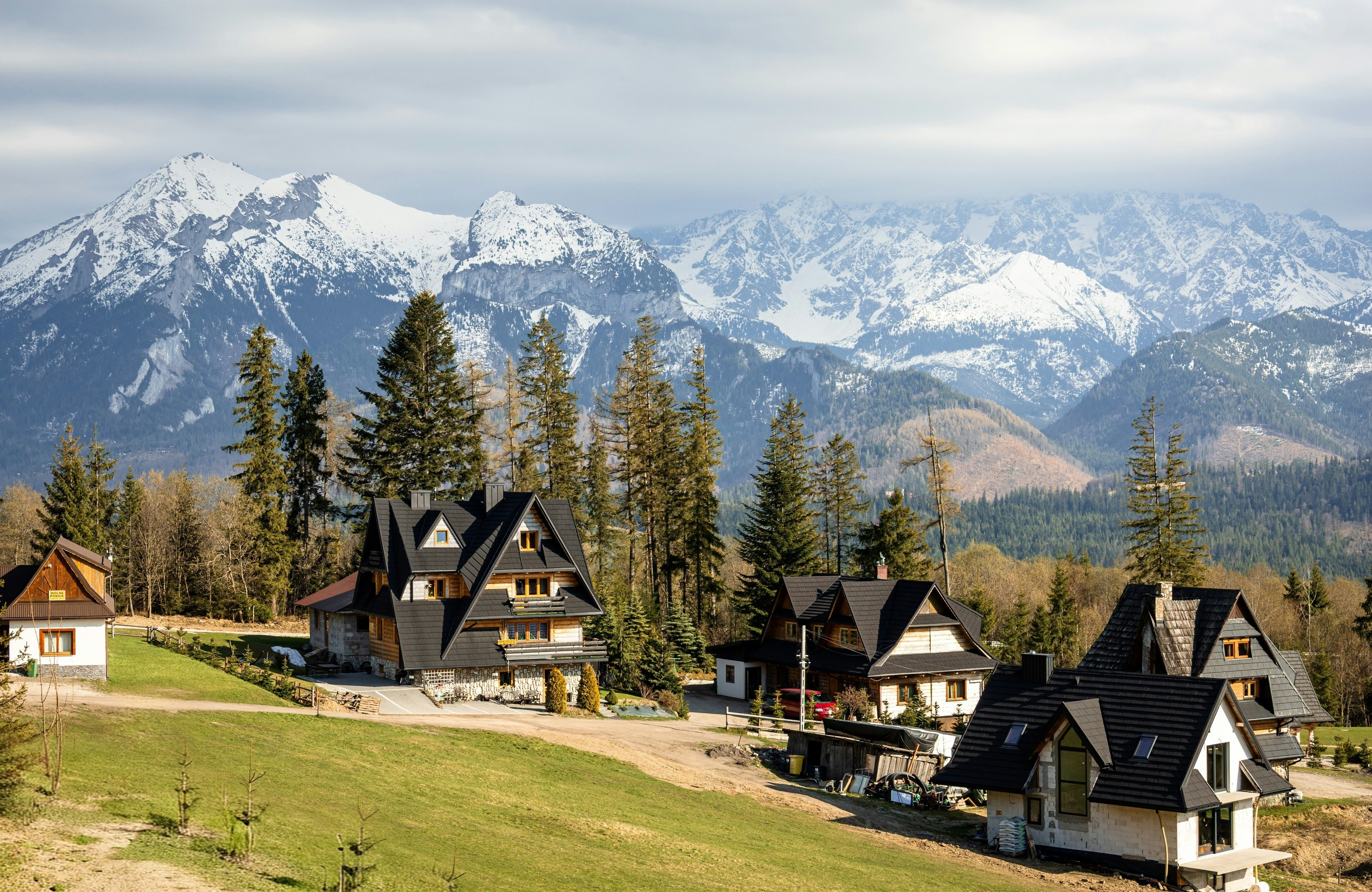  Alpine Village Settings Under Snow-Capped Peaks