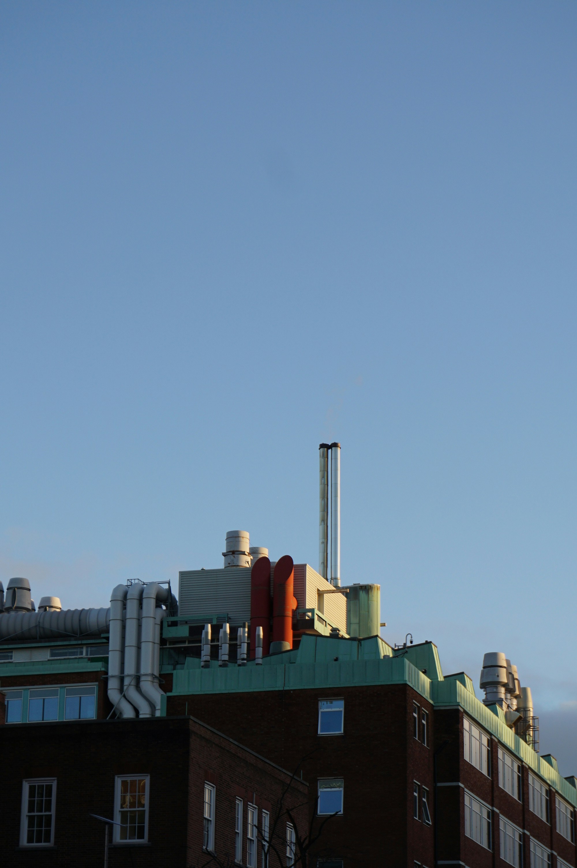 Factory Rooftop Against a Clear Sky