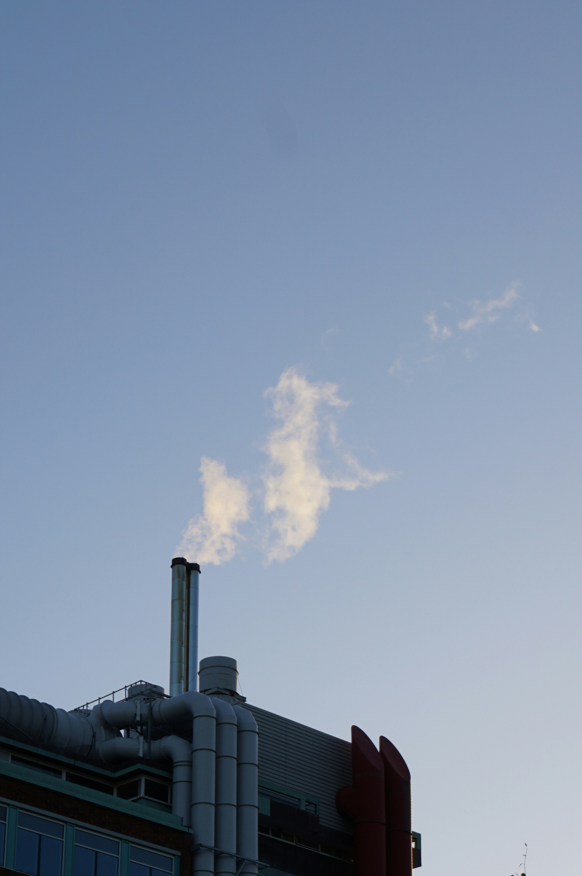 Industrial Chimney Amid Clear Skies