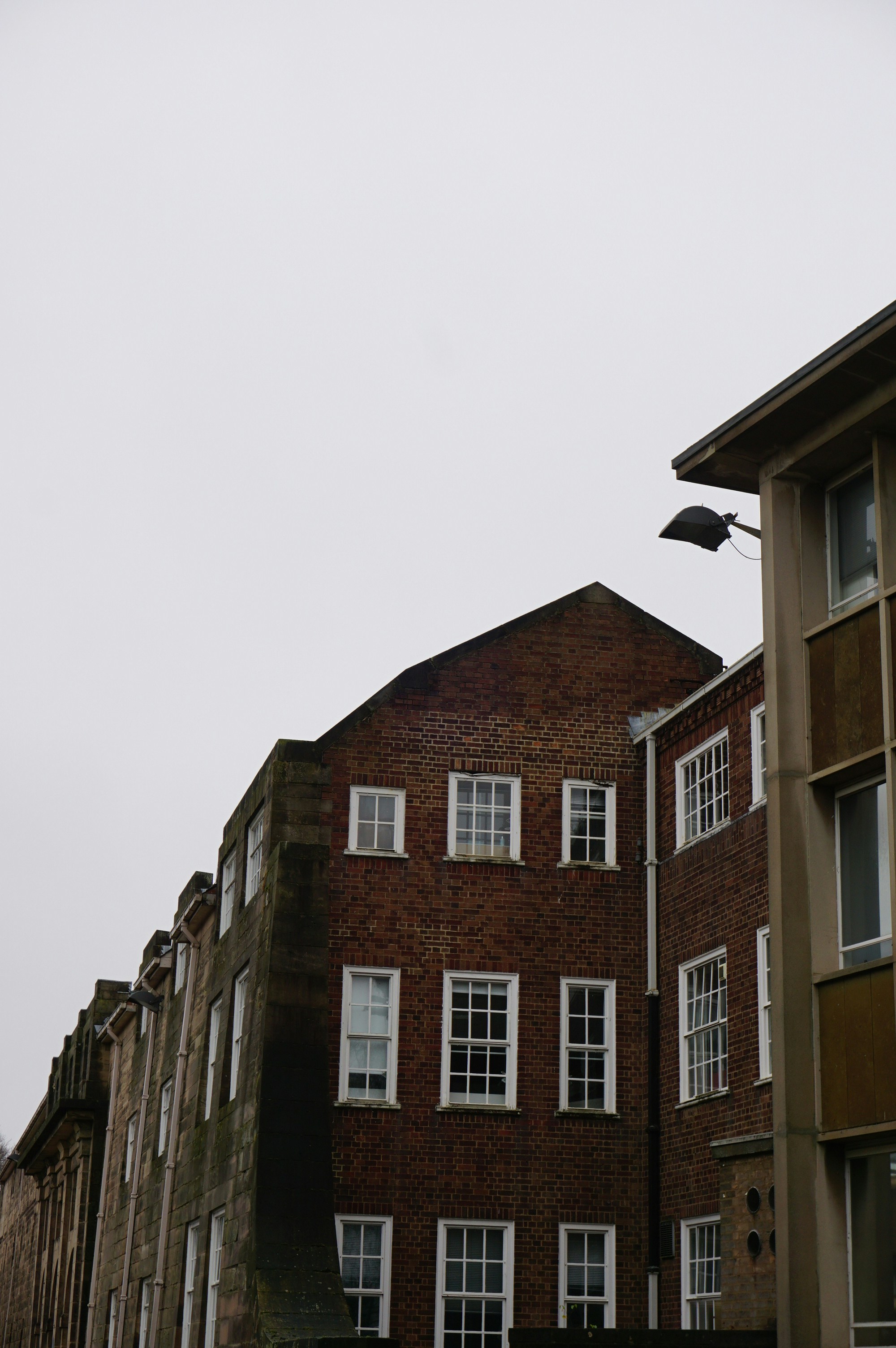 Brick Facade Rising Against a Grey Sky