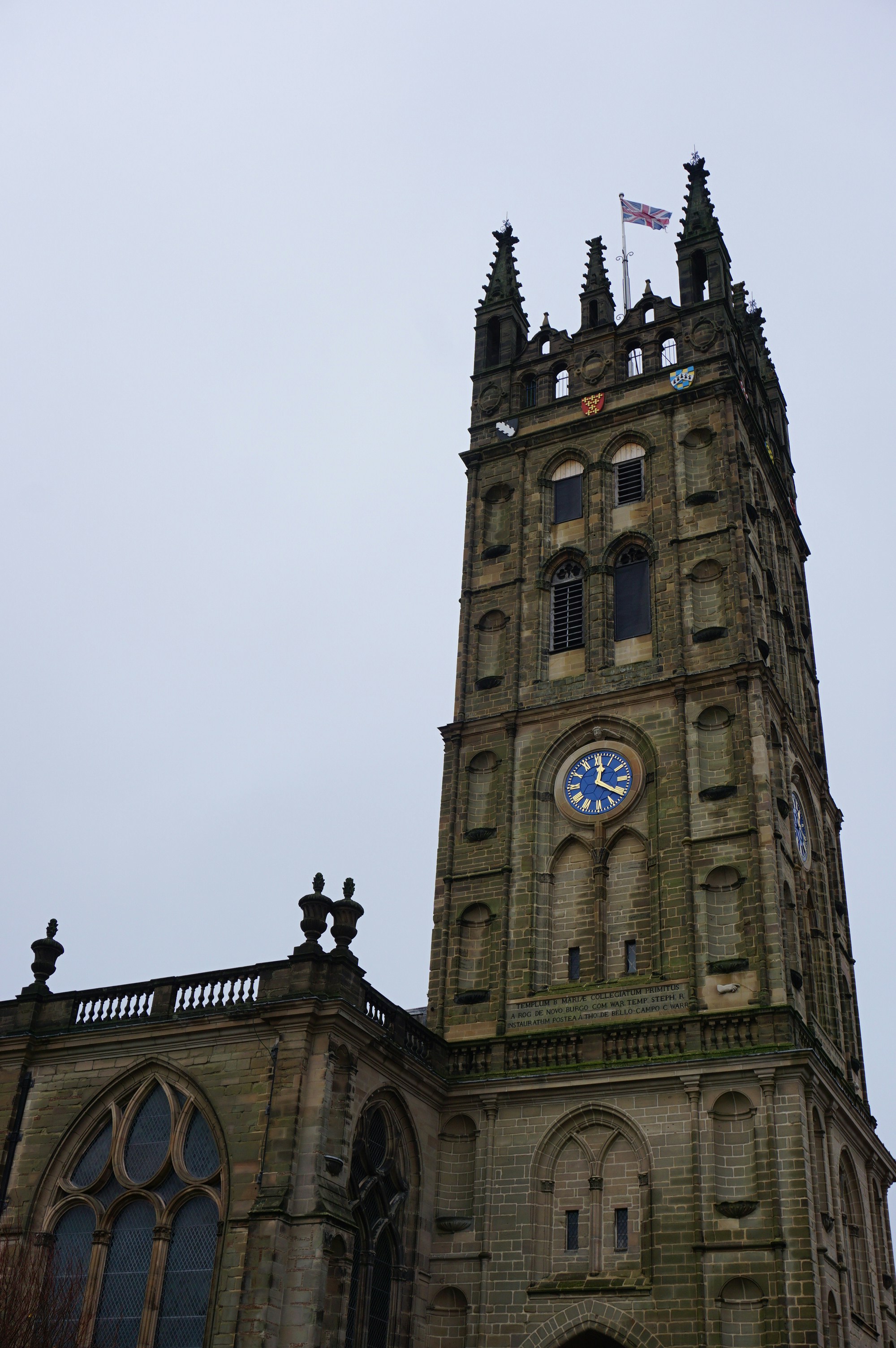 Gothic Clocktower Reaching Toward a Cloudy Sky