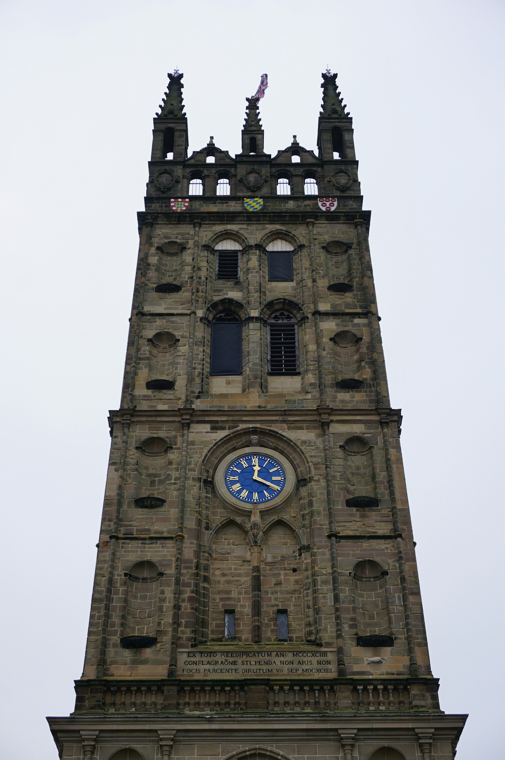 Towering Timekeeper: A Stone Clock Tower Reaching the Sky