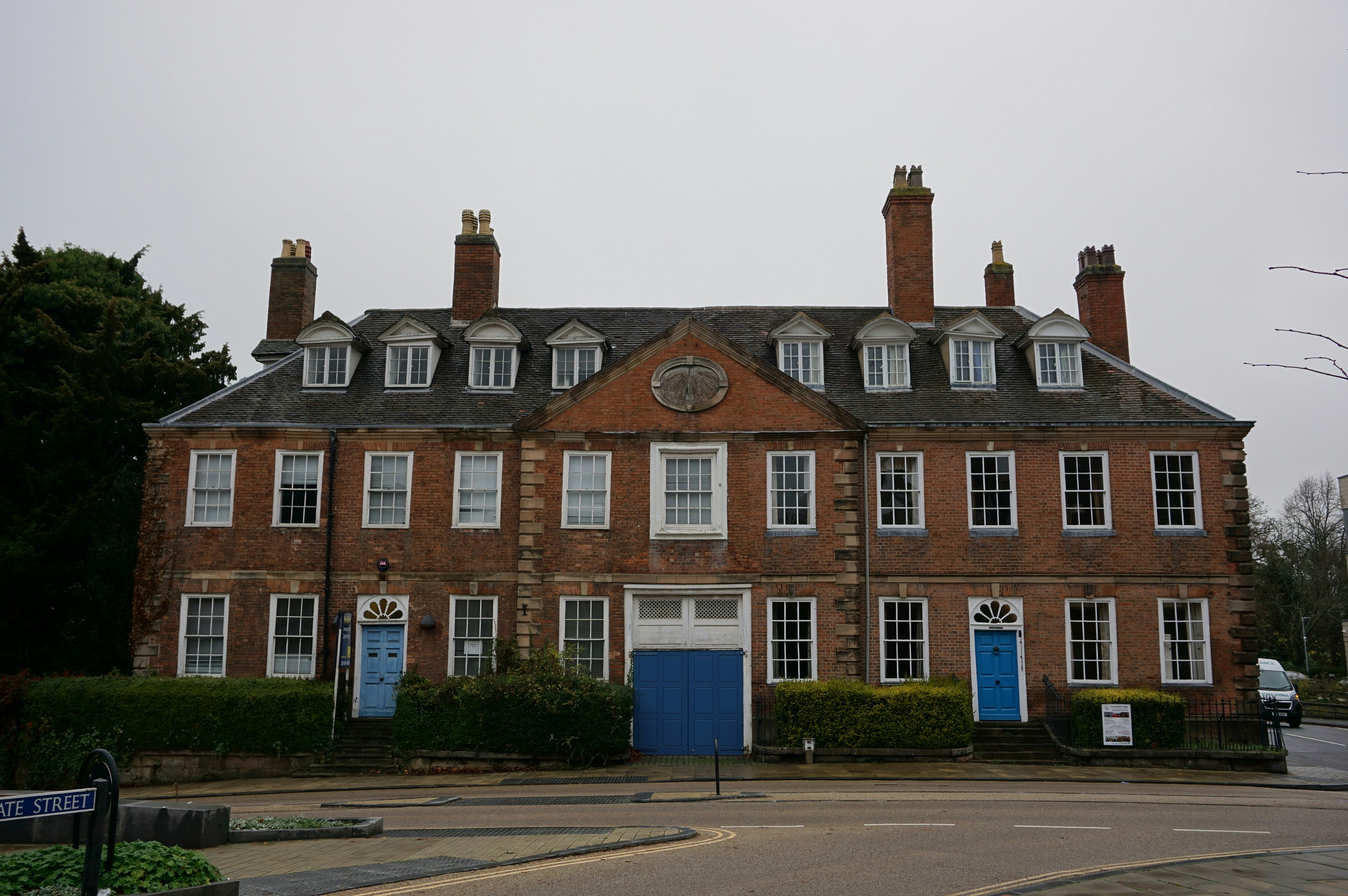 Symmetric Georgian FAÇADE: Blue Doors and Brick Manor