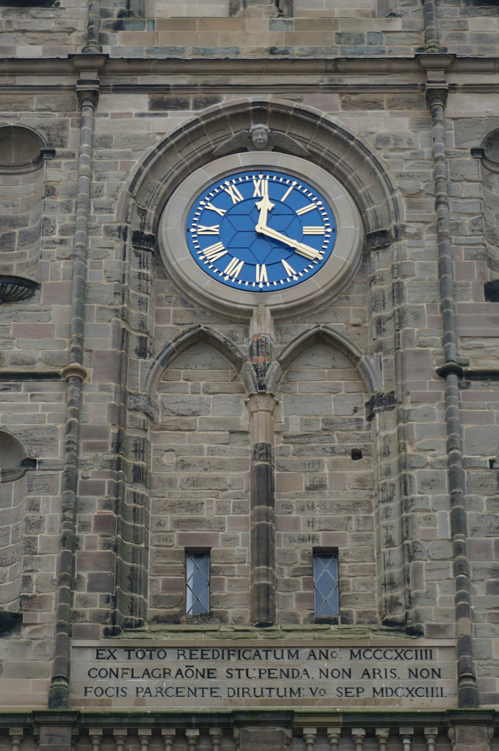 Orb of Time: Blue Clock in a Stone Facade