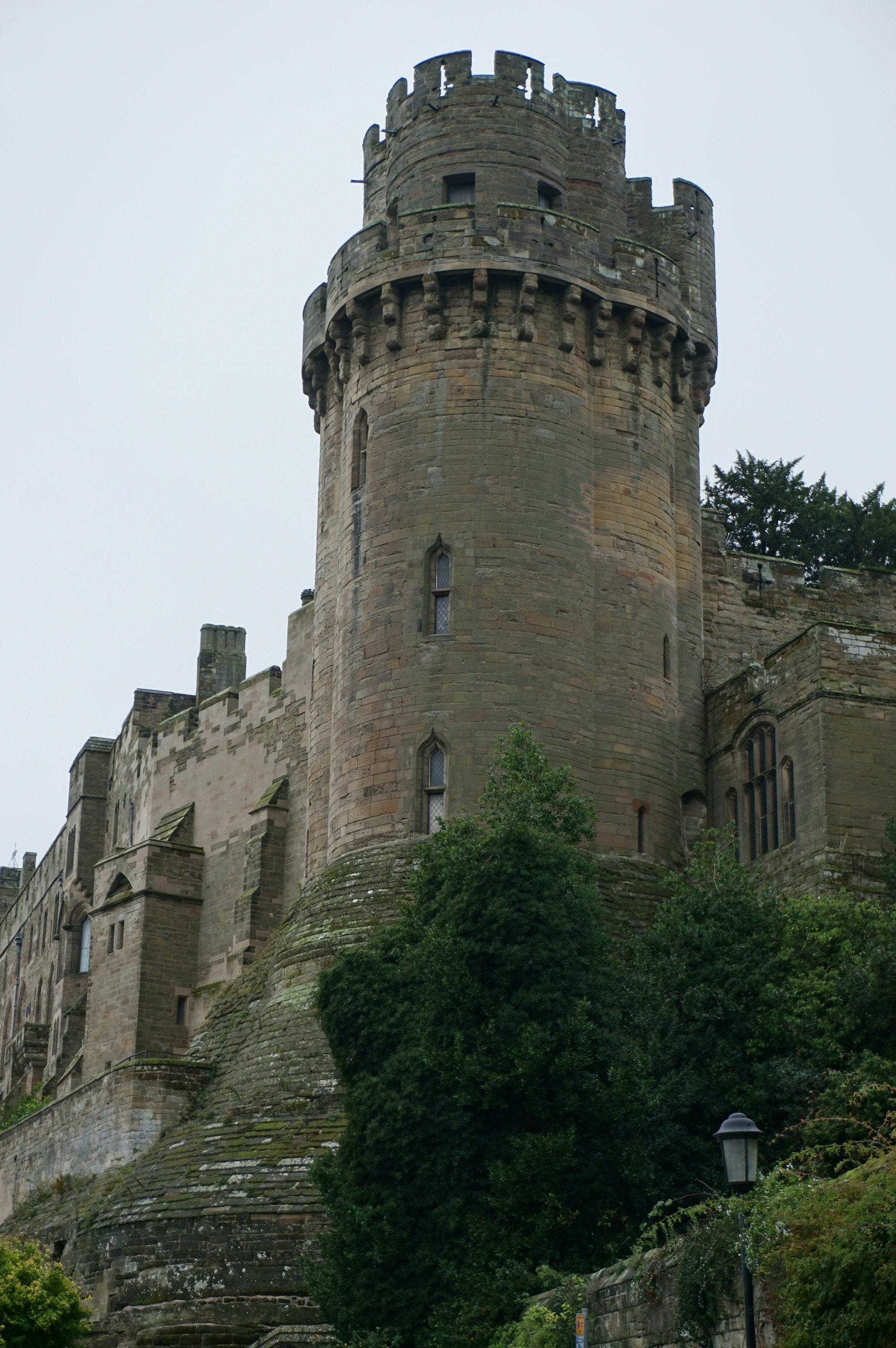 Castle Tower Rising Above Stone Walls