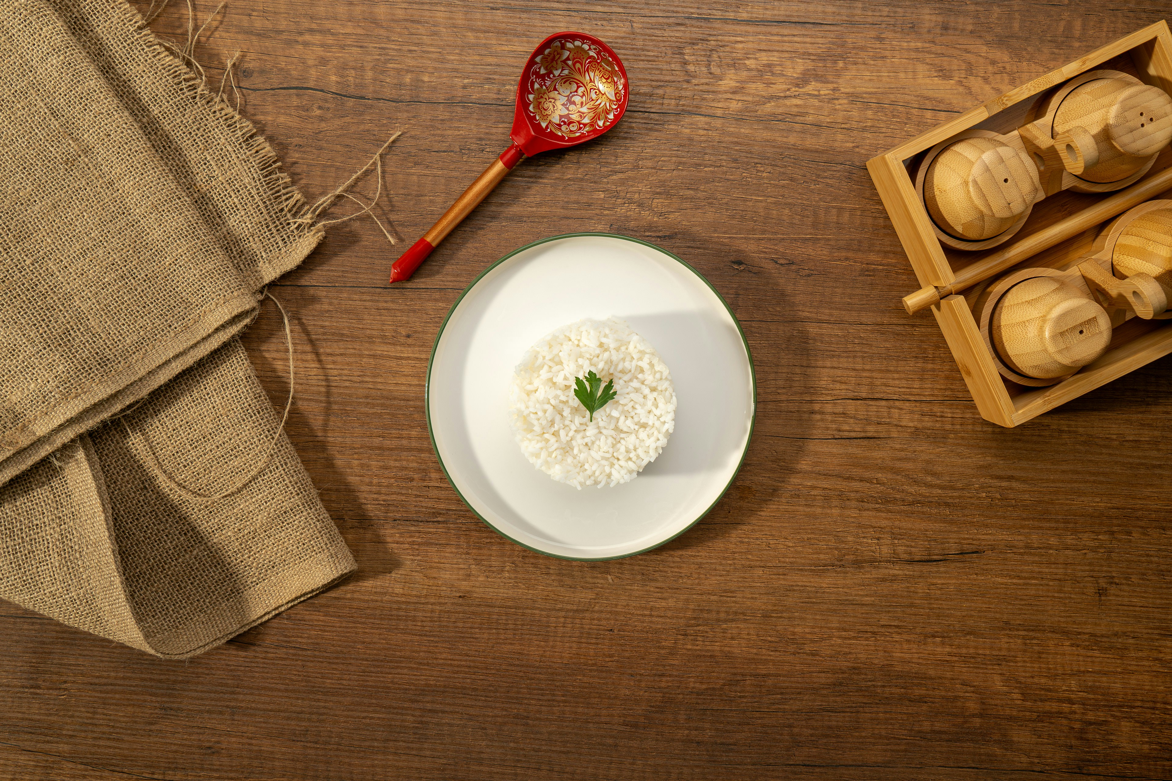 A Rustic Spoonful: Rice Dome Centered on a Wooden Table