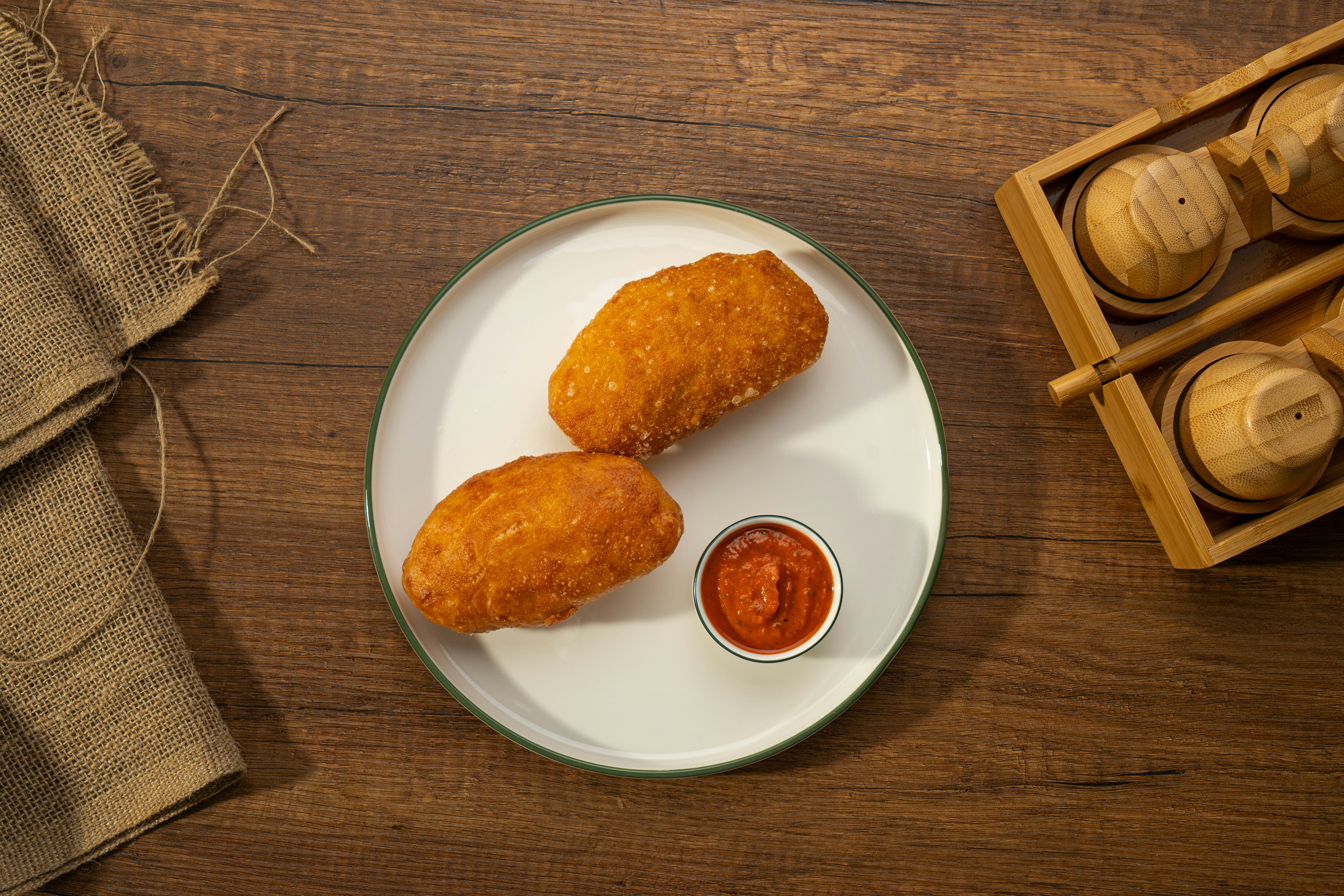 Golden Bites on a Wooden Stage: Fried Mayhem with Dipping Sauce