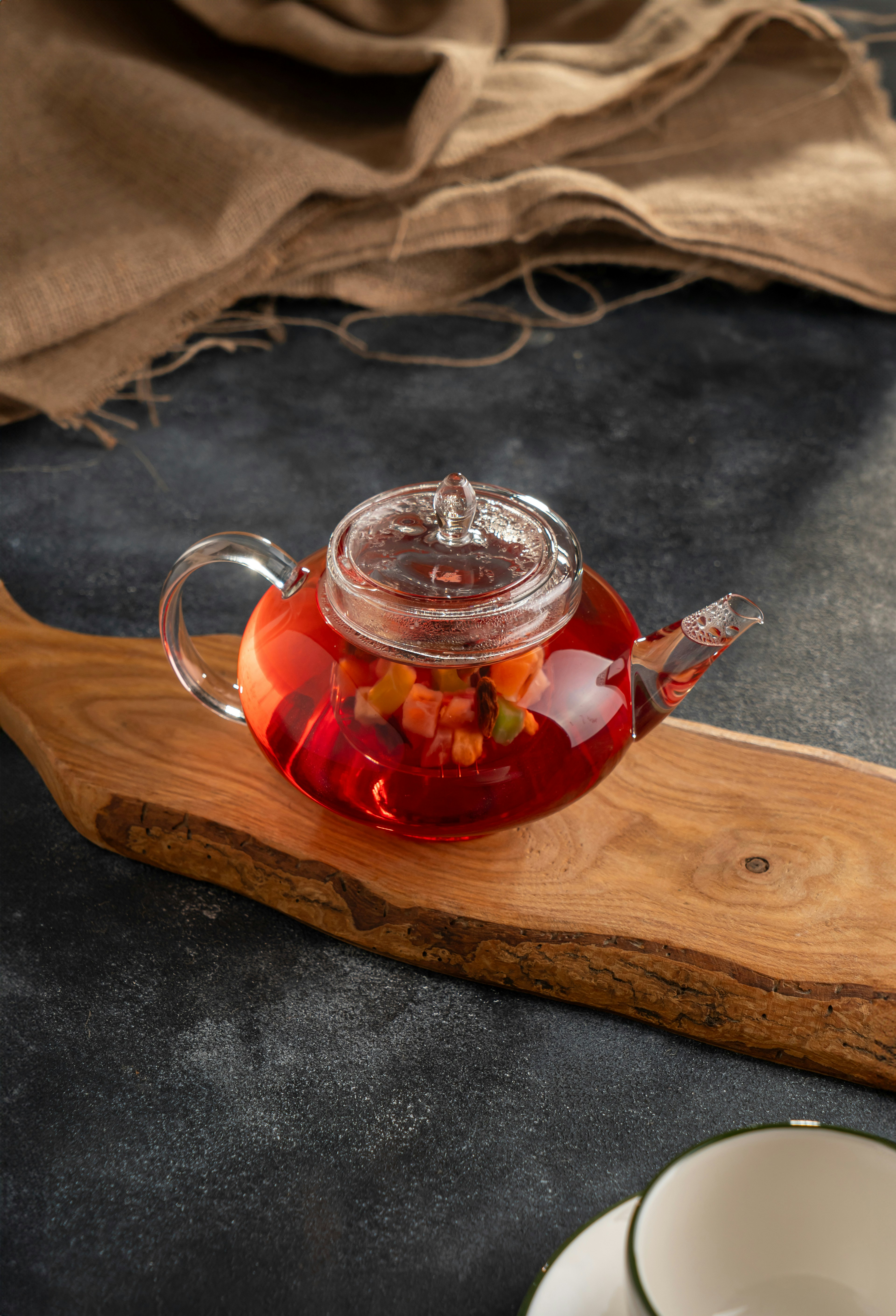 Crimson Teapot on a Weathered Slab