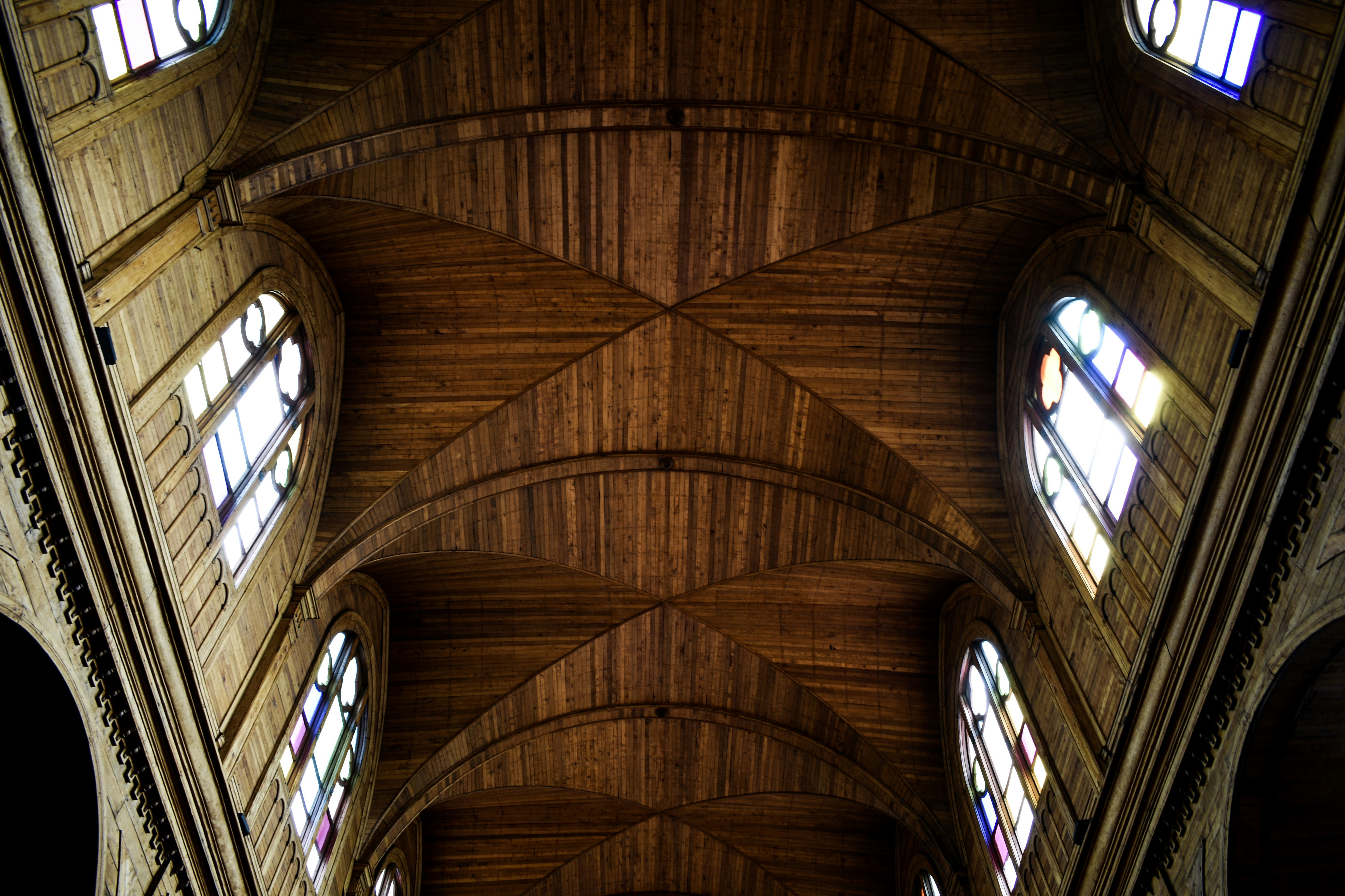 Vaulted Timber Choir: Symmetry Beneath Stained Light