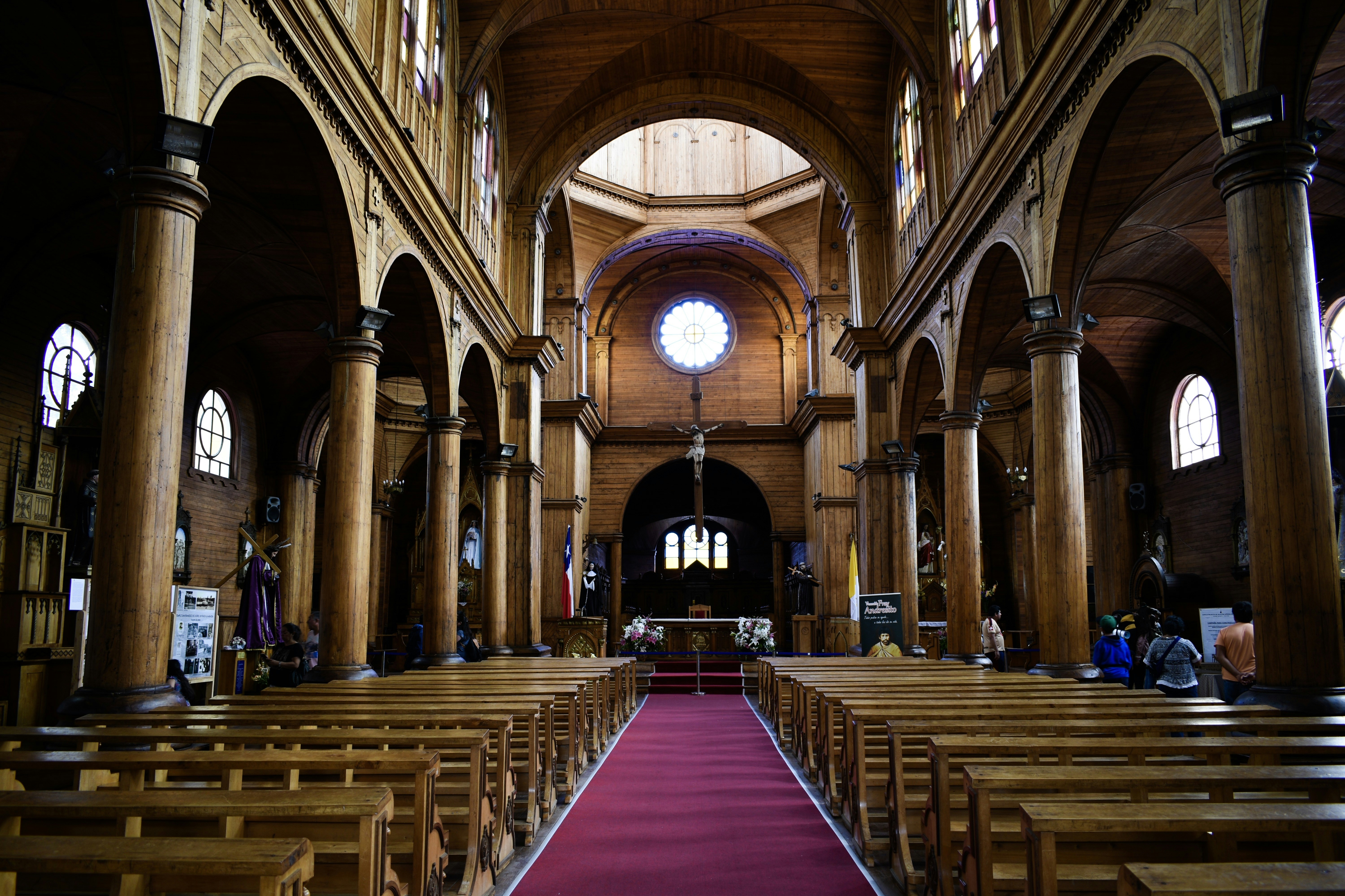 Apex of Quiet Grandeur: A Red Carpet through a Historic Nave