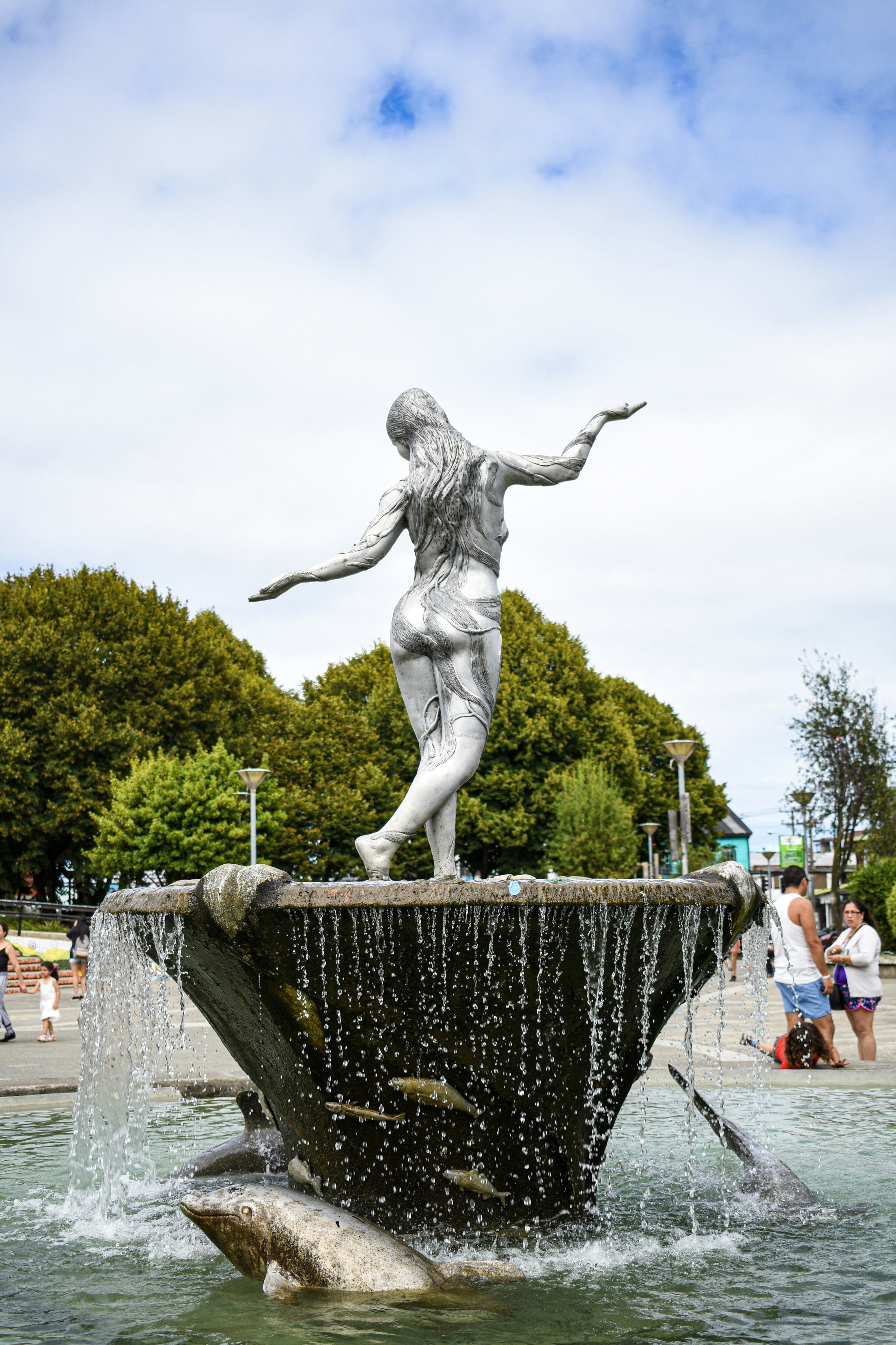 Waterfall Frame: A Freestanding Statue Overlooking a Fountain
