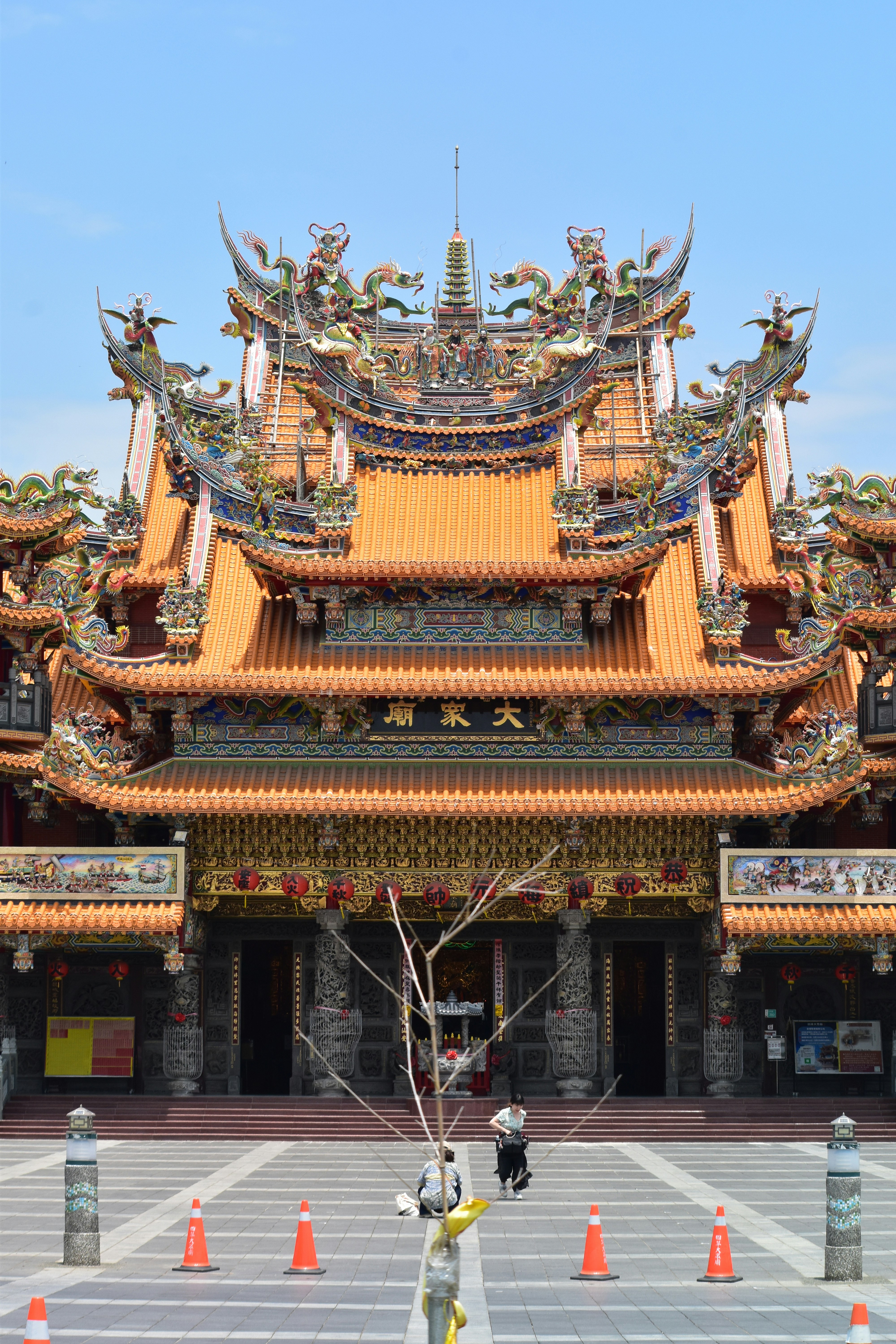 Front Facade of a Colorful Temple with Intricate Roof Ornaments